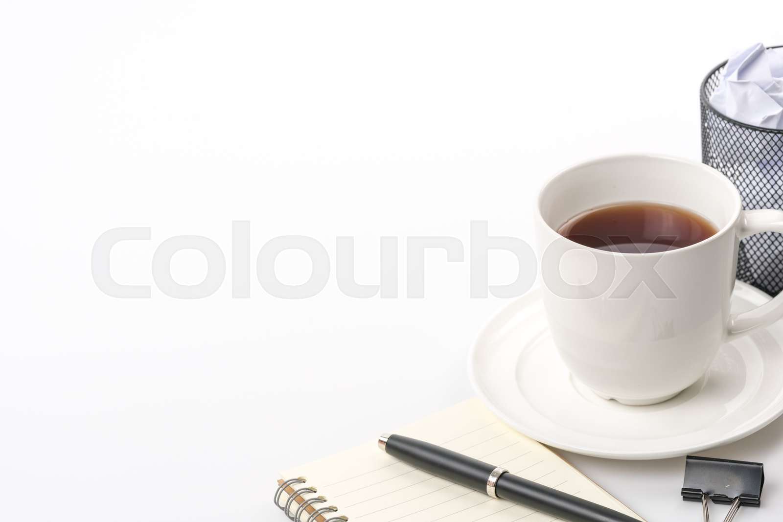 Cup of tea on the office desk. | Stock image | Colourbox