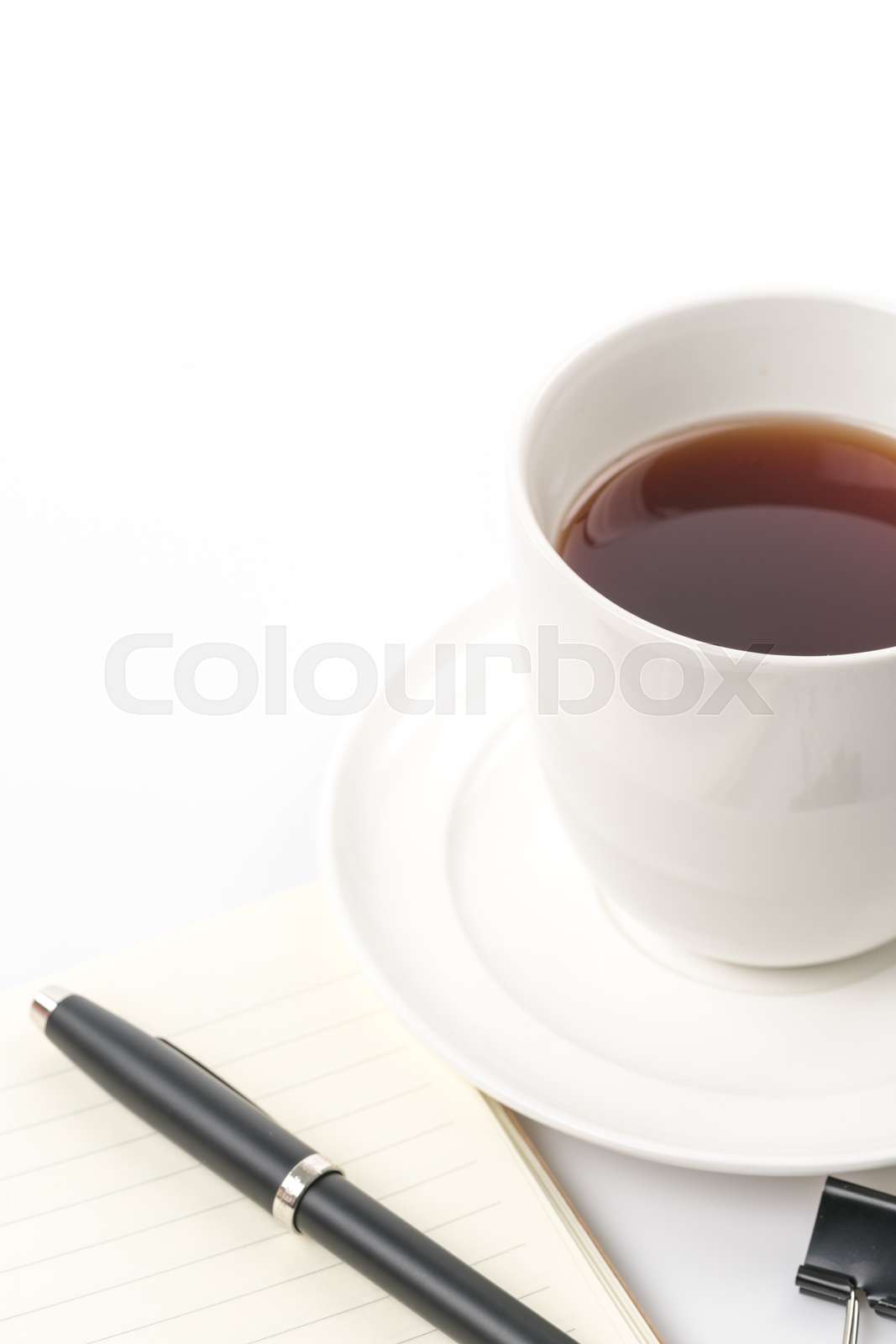 Cup of tea on the office desk. | Stock image | Colourbox