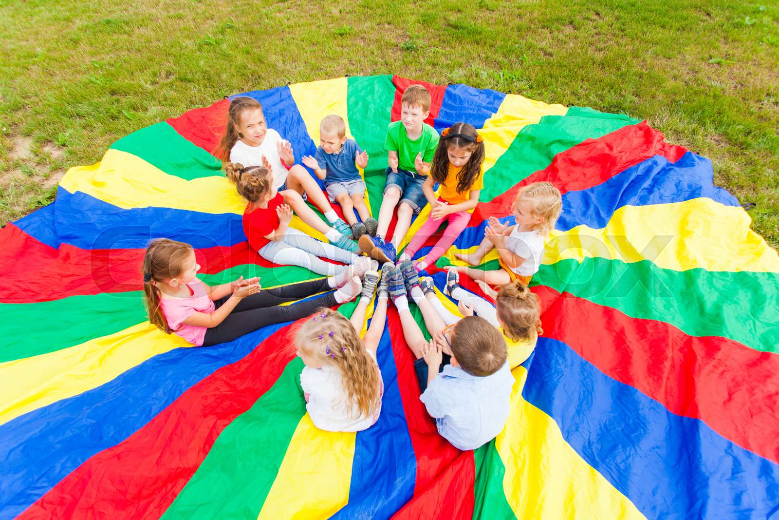 Kids siting and clapping ther hands | Stock image | Colourbox