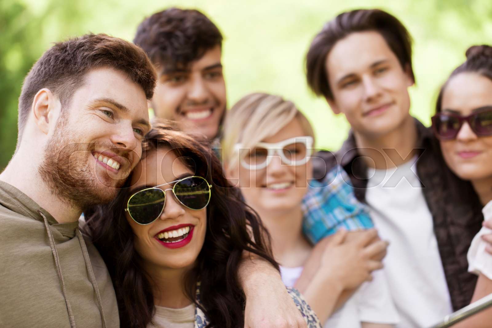 group of happy smiling friends outdoors | Stock image | Colourbox