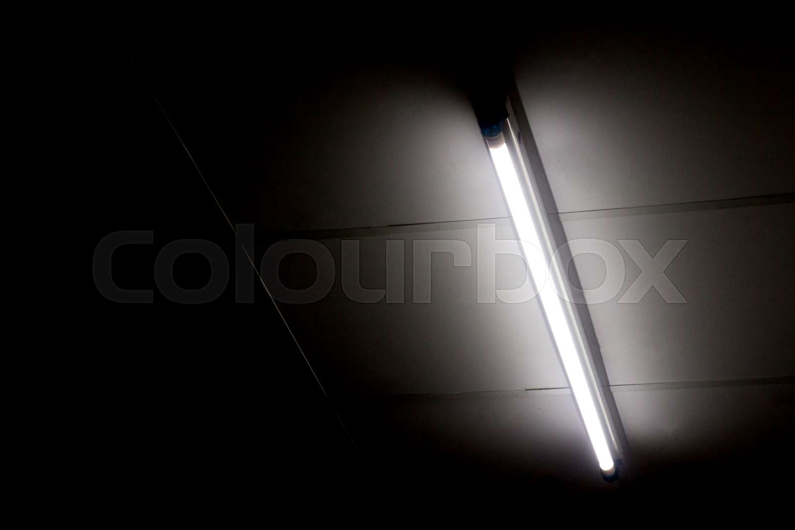 Fluorescent light tube on the wall | Stock image | Colourbox