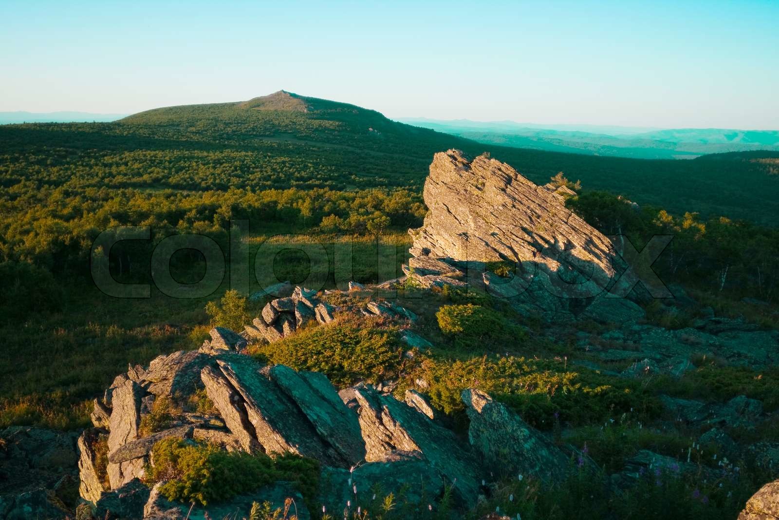 Urals mountain view with rocks and view to highest peak of south Ural ...