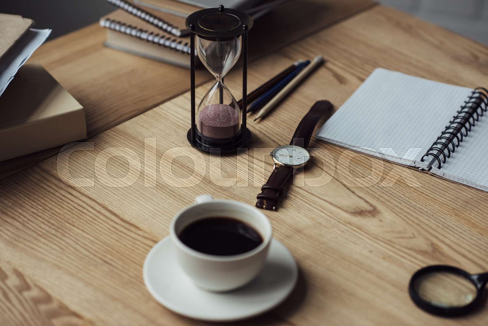 cup of coffee white hourglass and watch on workplace | Stock image ...