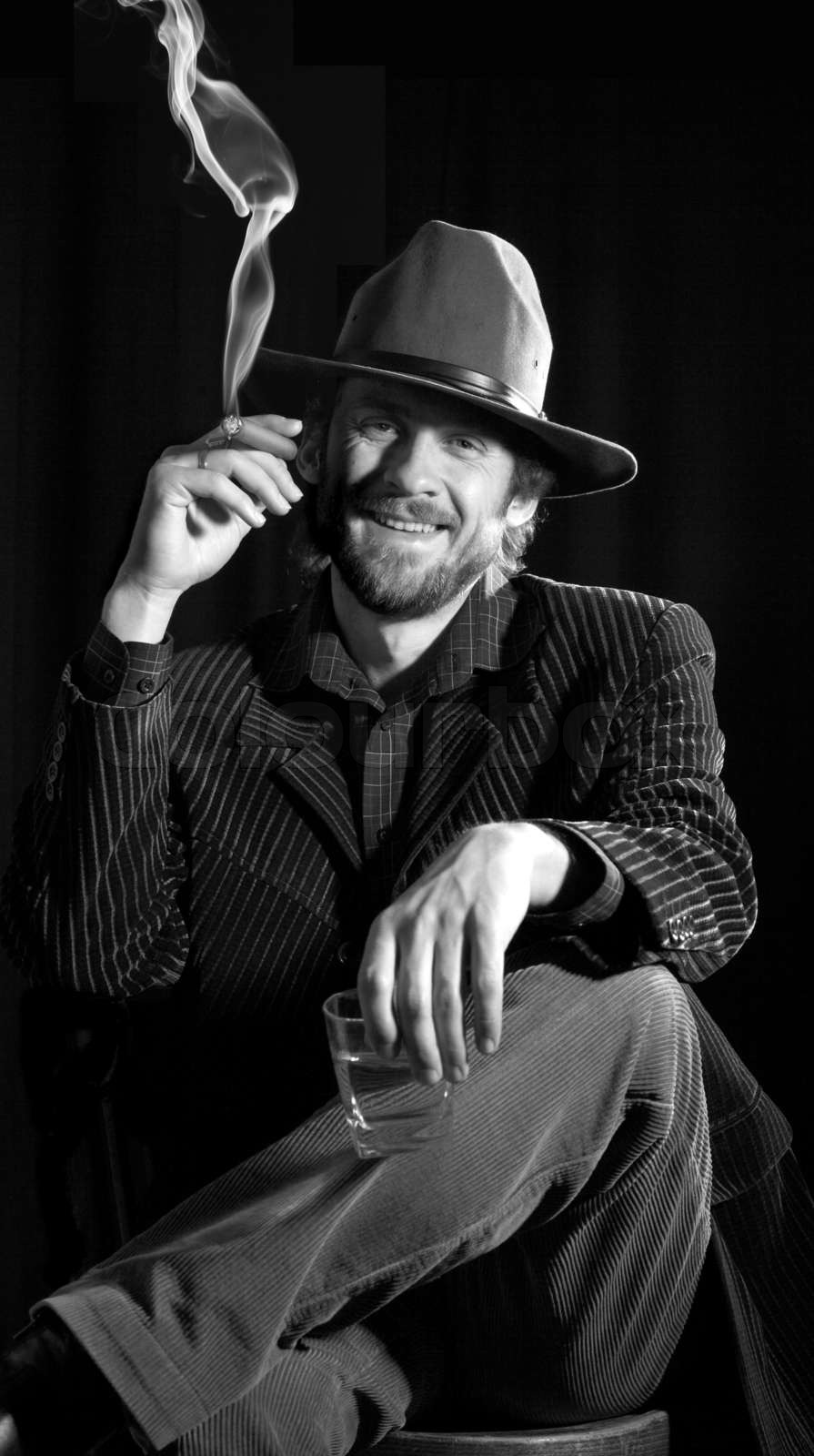 An image of a smiling man smoking cigar | Stock image | Colourbox