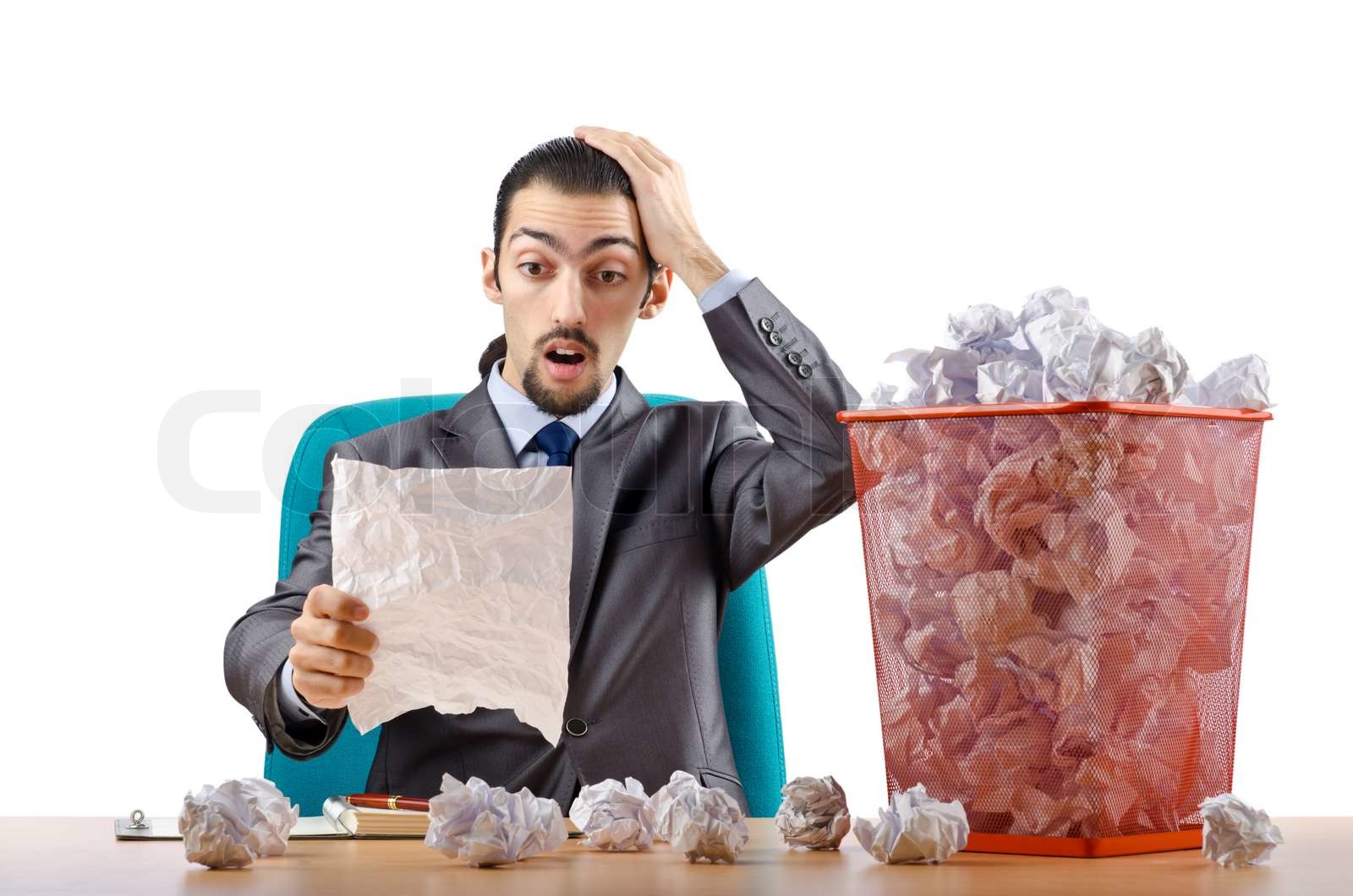 Man with lots of wasted paper | Stock image | Colourbox