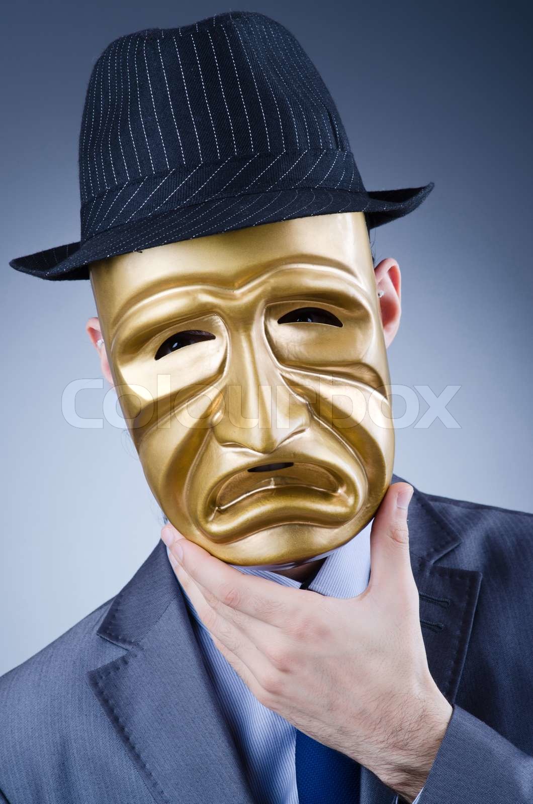 Businessman with mask concealing his identity | Stock image | Colourbox