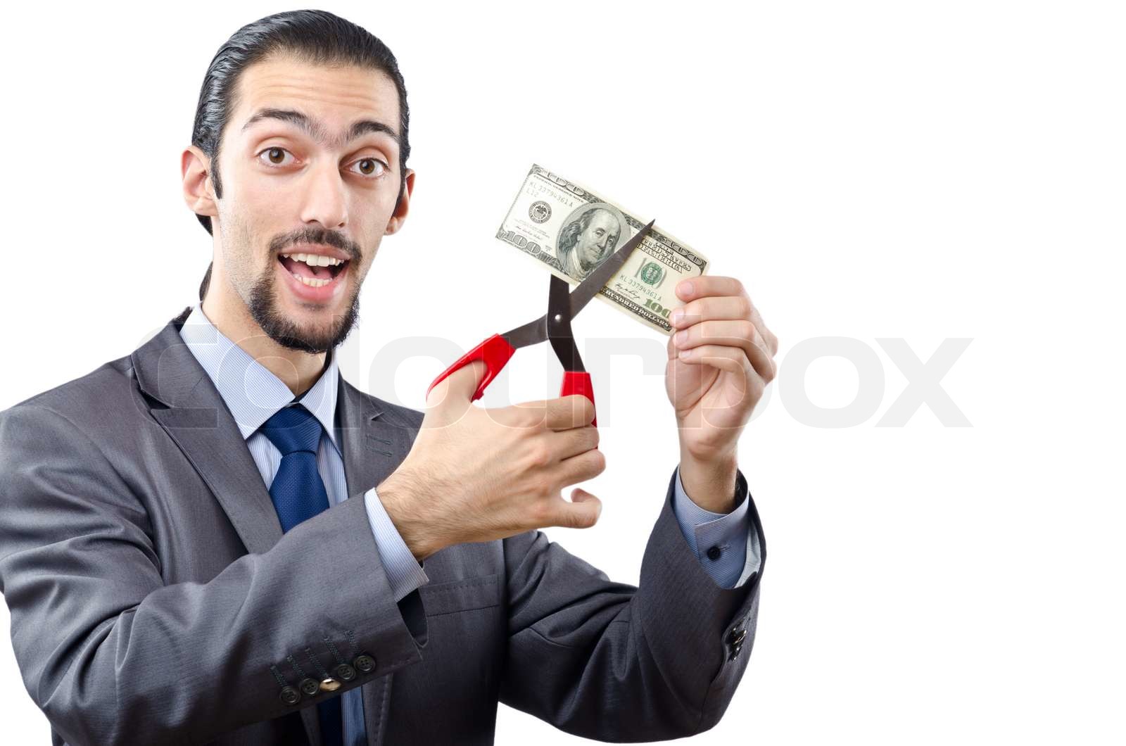 Man cutting money on white | Stock image | Colourbox