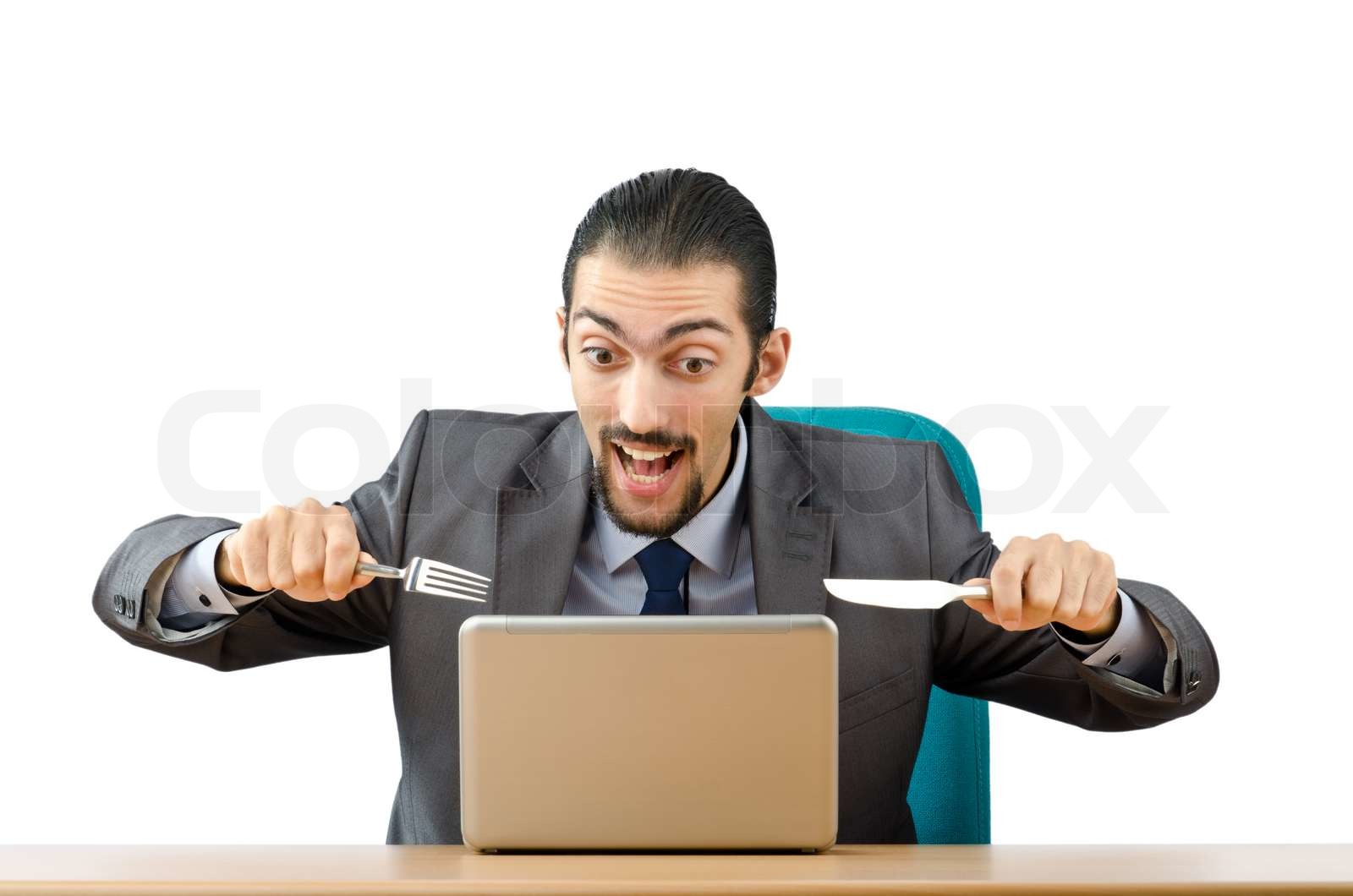 Man eating his laptop - stupid concept | Stock image | Colourbox