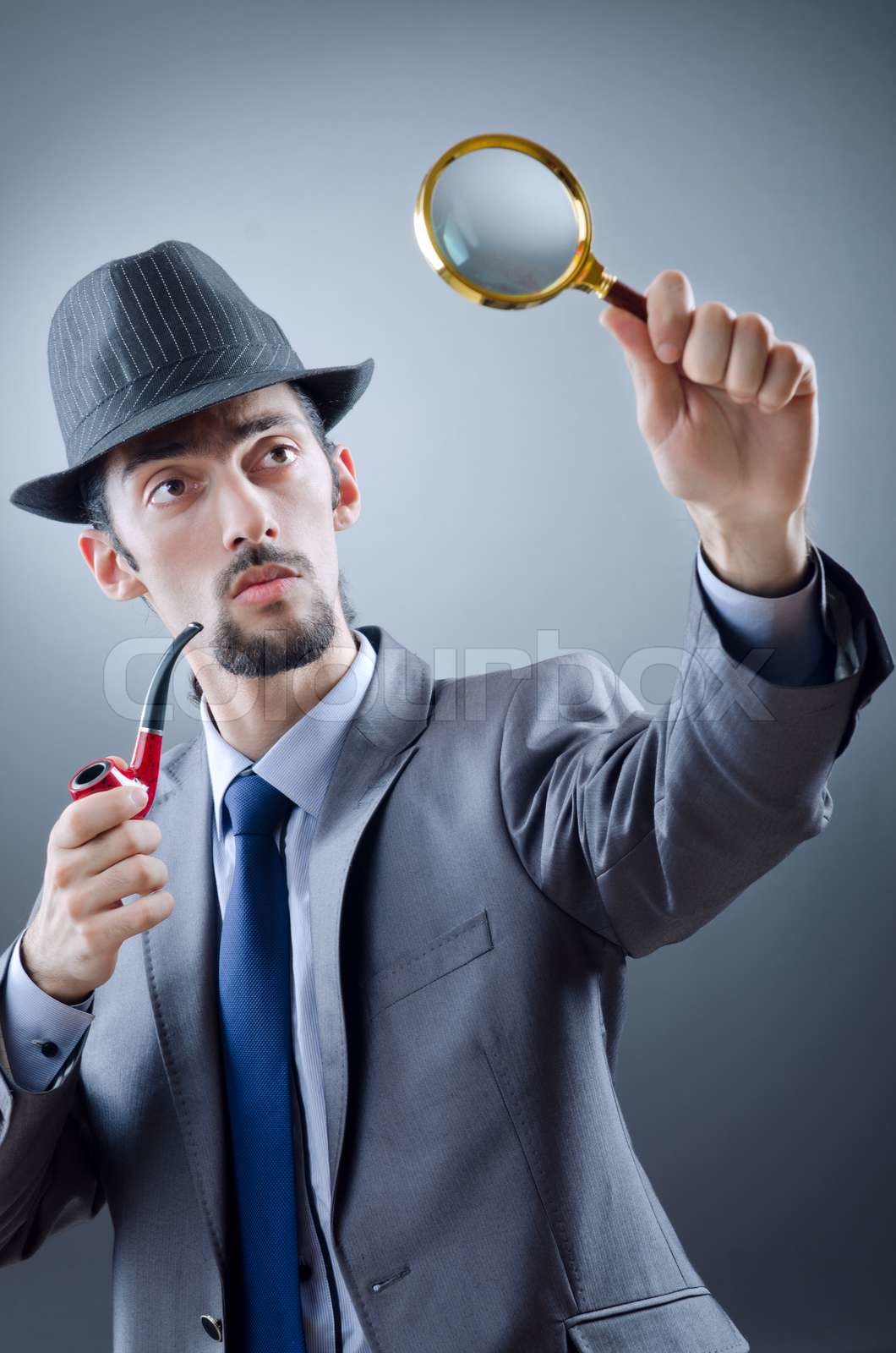 Detective with the smoking pipe | Stock image | Colourbox