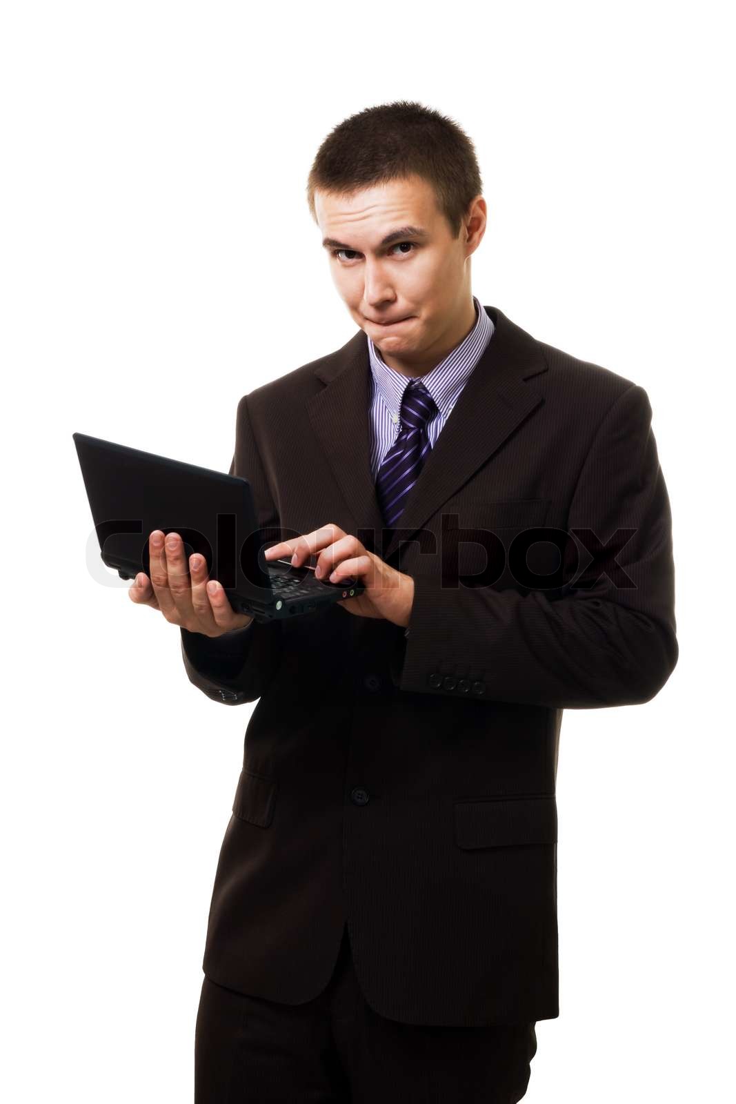 Young business man work hard,stand with laptop,isolated on white ...