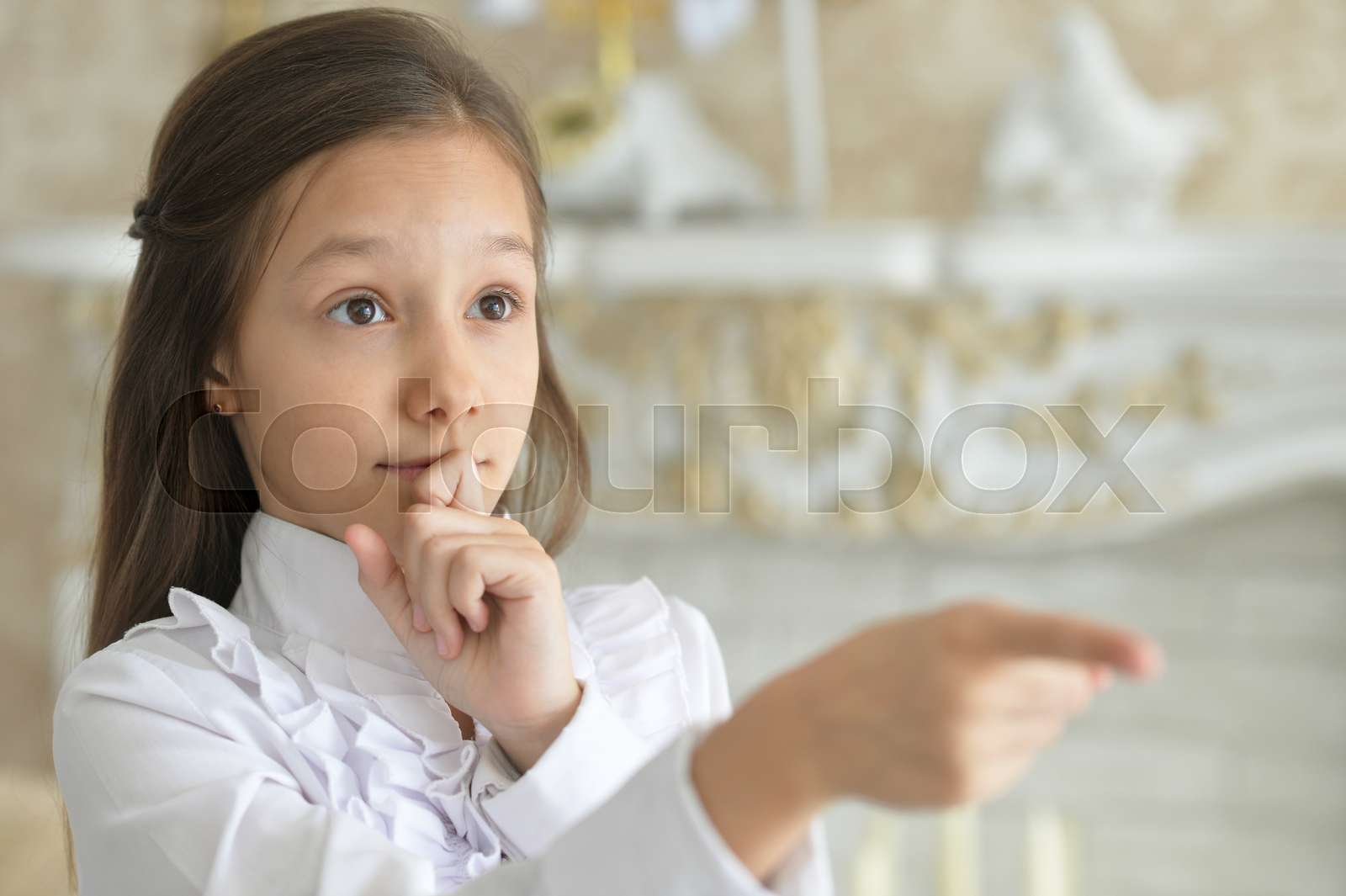 Emotional little girl pointing | Stock image | Colourbox