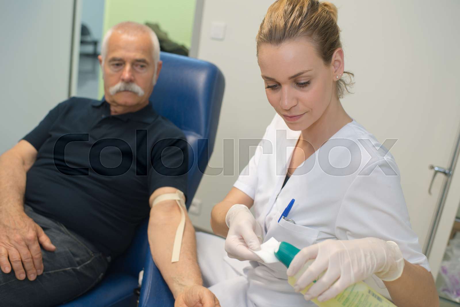 senior man and nurse checking blood sugar level | Stock image | Colourbox