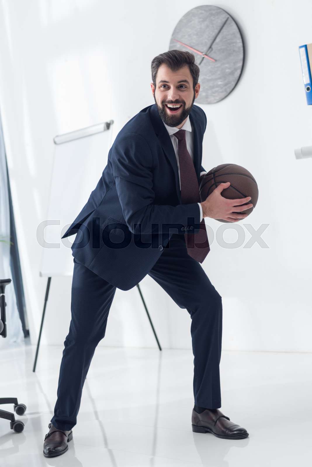 businessman in suit playing basketball | Stock image | Colourbox