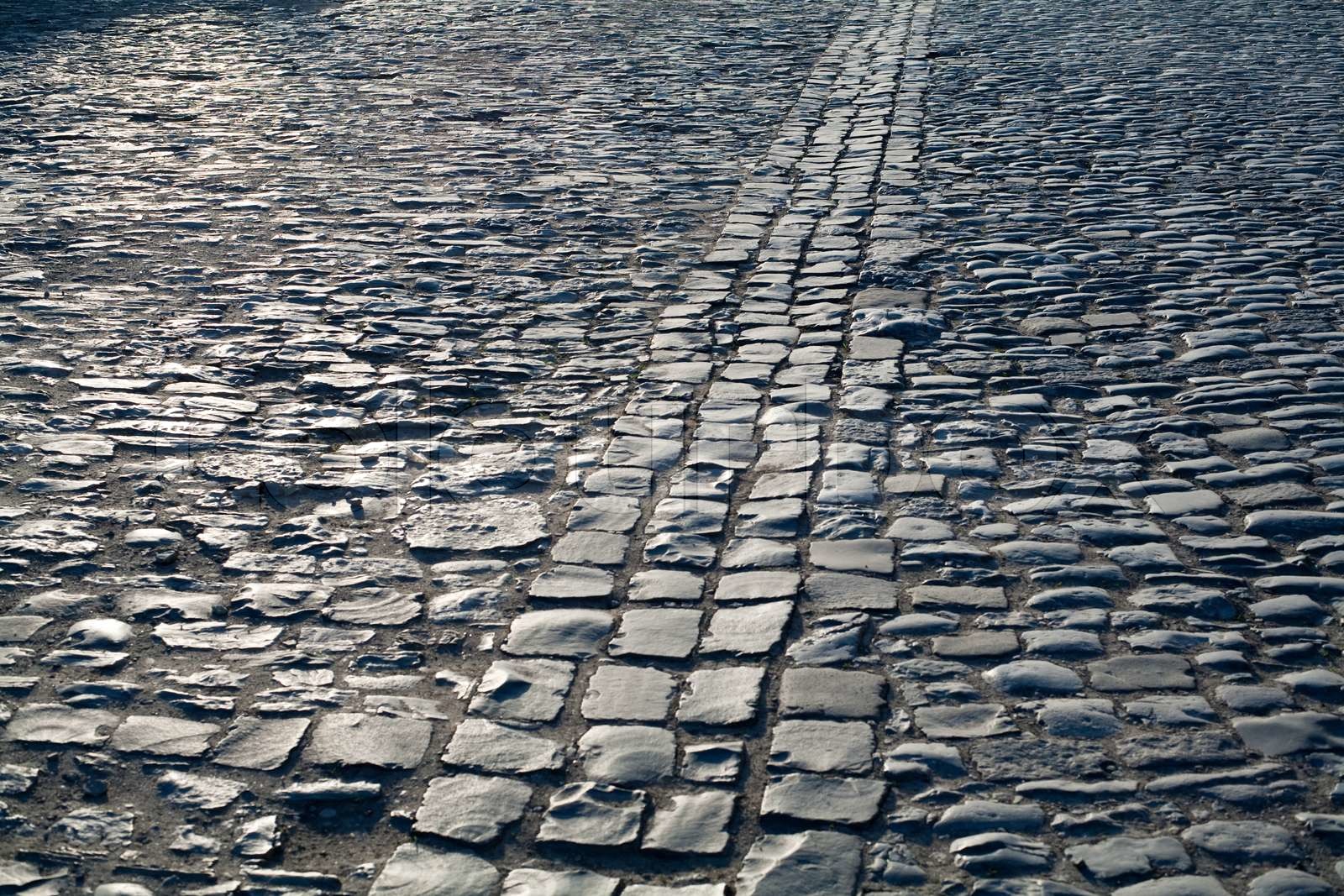 Et billede af en gammel vej af grå sten | Stock foto | Colourbox
