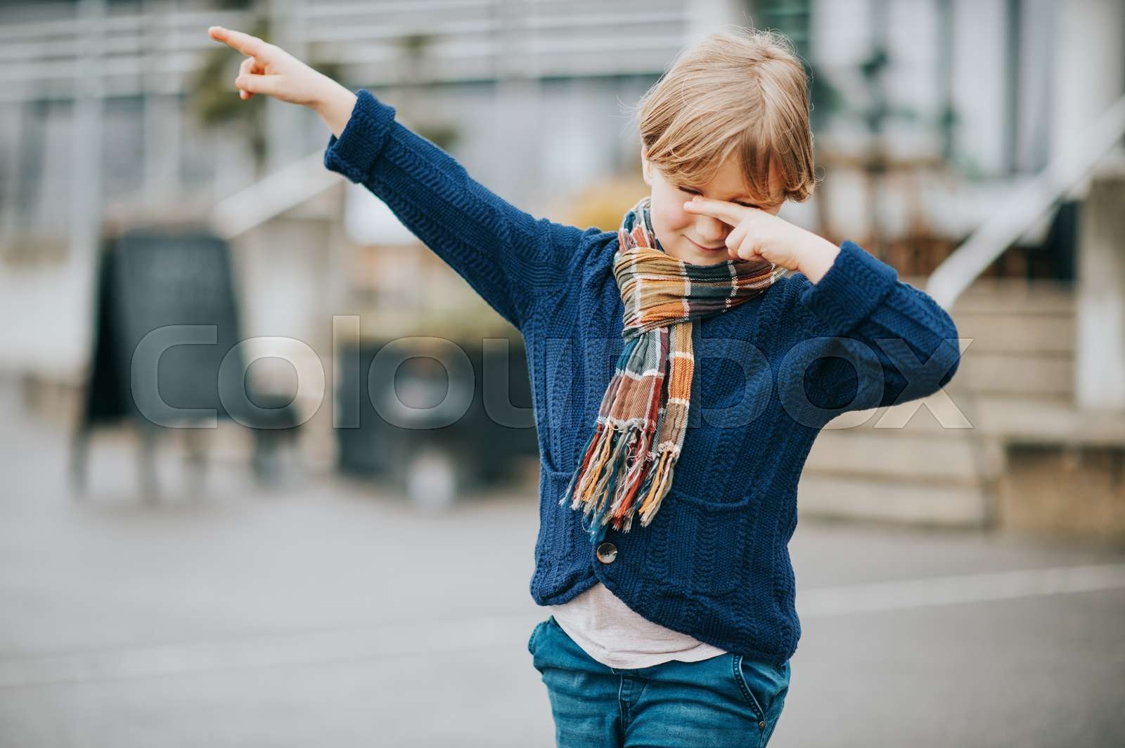 Little boy making dab dance outdoors | Stock image | Colourbox