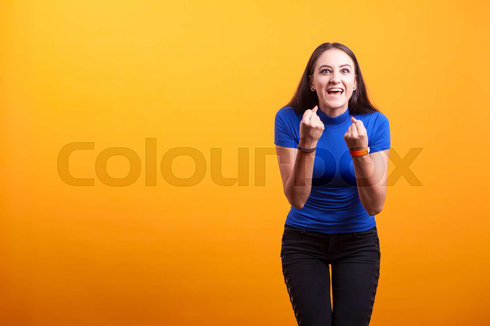 Angry woman yelling in studio | Stock image | Colourbox