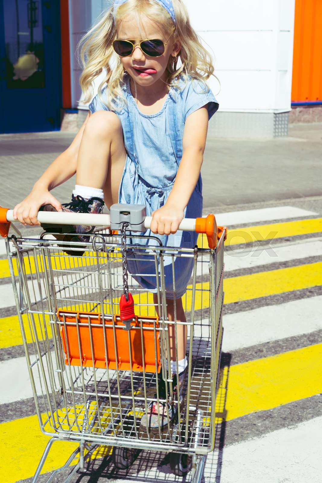 child in shopping cart | Stock image | Colourbox