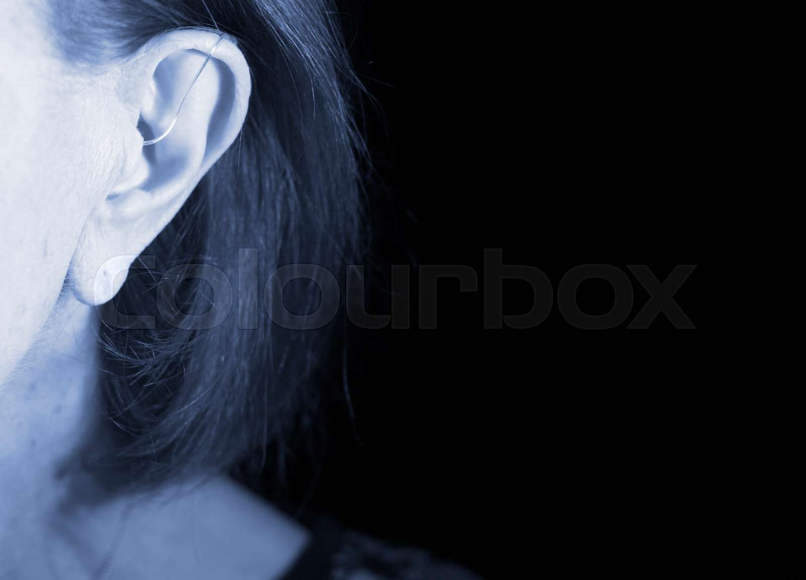 Deaf woman hearing aid ear | Stock image | Colourbox