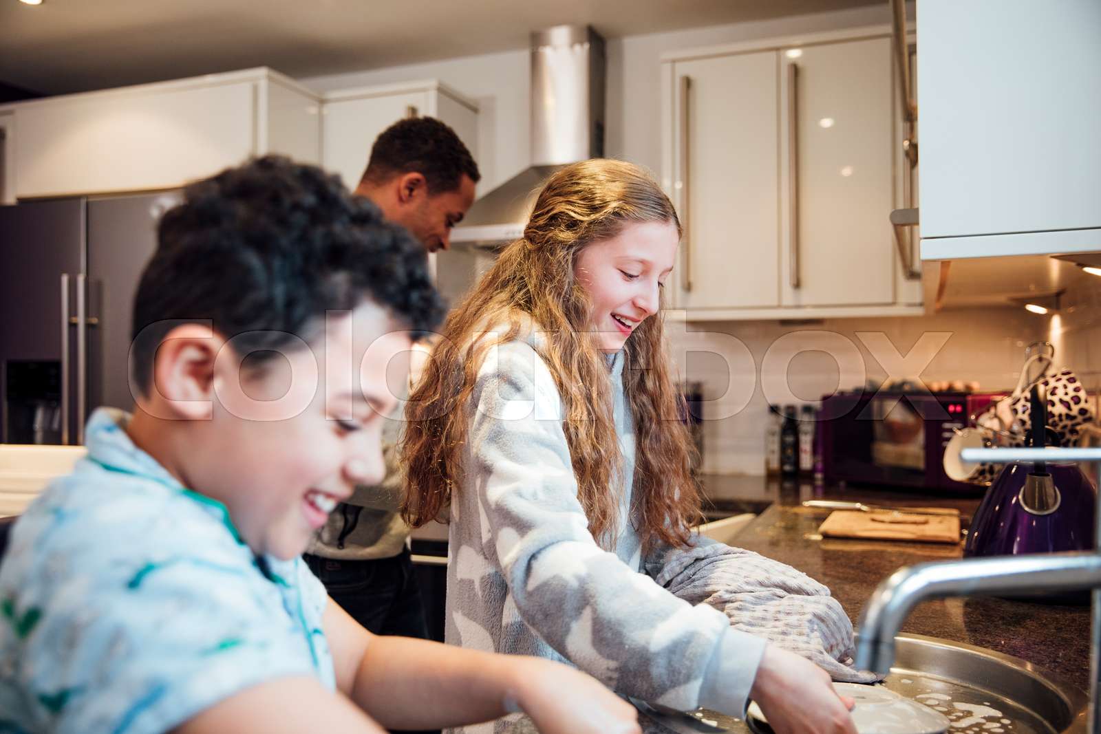 Siblings Doing the Dishes at Home | Stock image | Colourbox