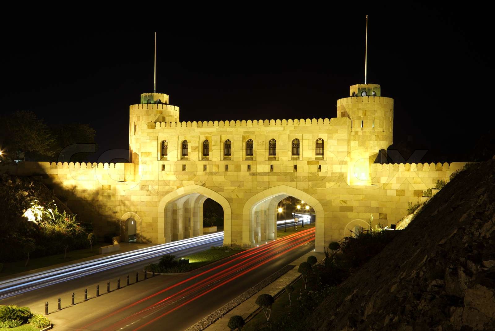 Gate to the old town of Muscat illuminated at night | Stock image ...