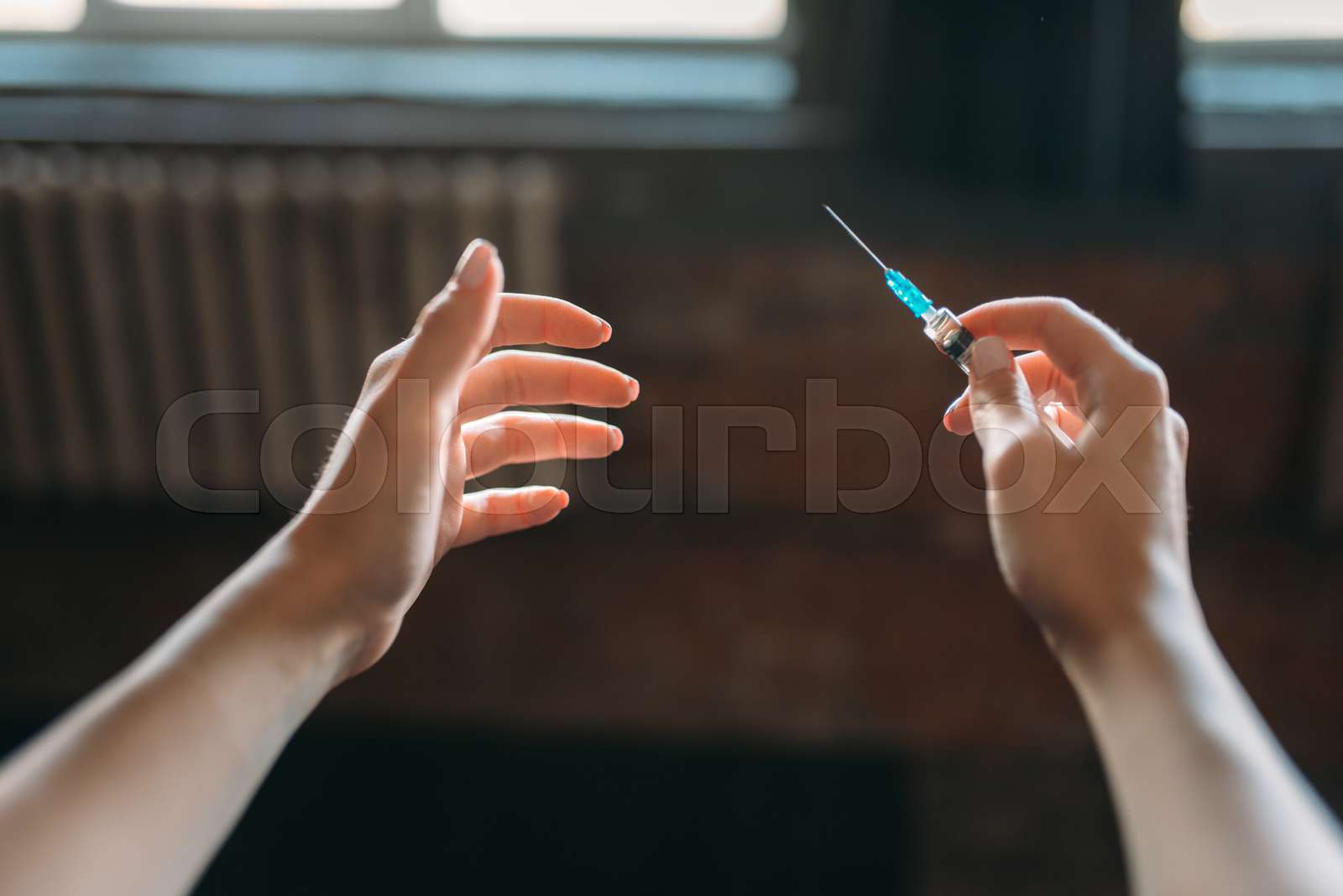 Junkie hands with syringe, drug addiction concept | Stock image | Colourbox