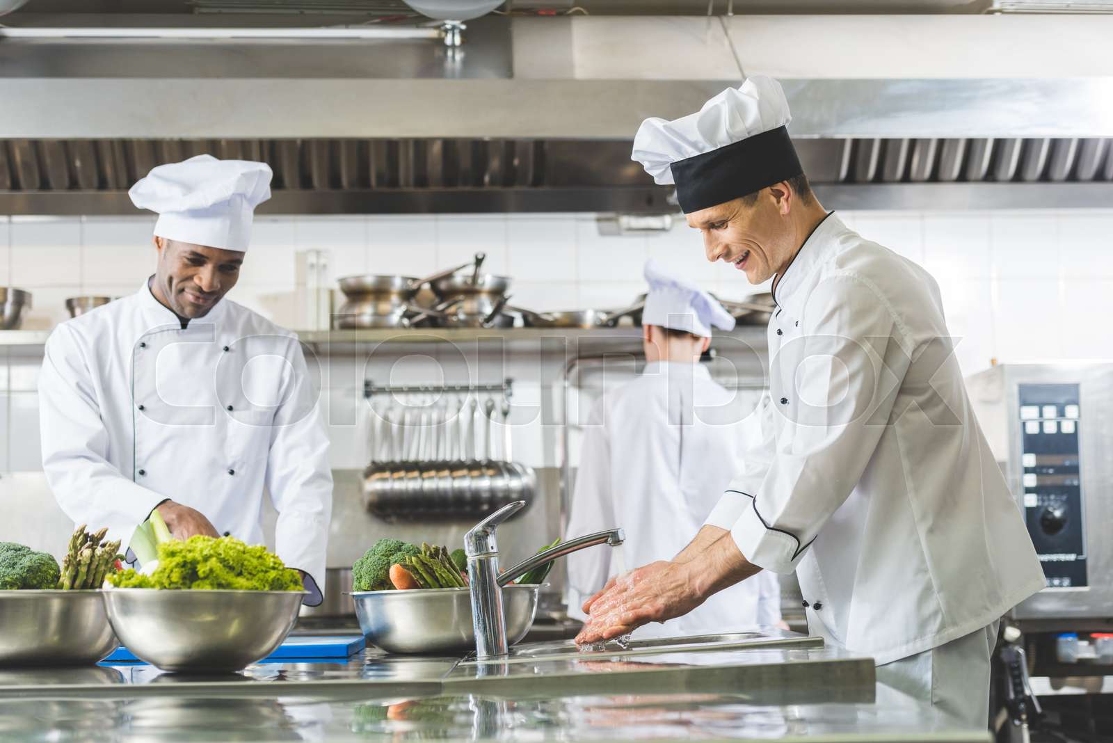 multicultural chefs working at restaurant kitchen | Stock image | Colourbox