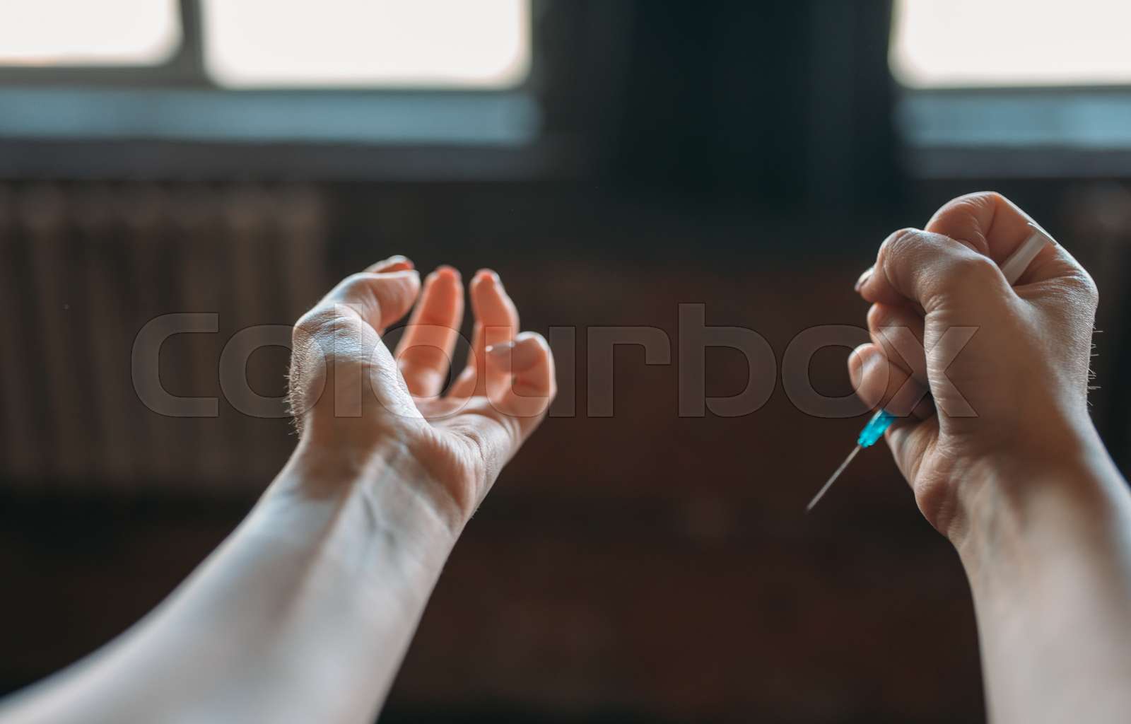 Junkie hands with syringe, drug addiction concept | Stock image | Colourbox