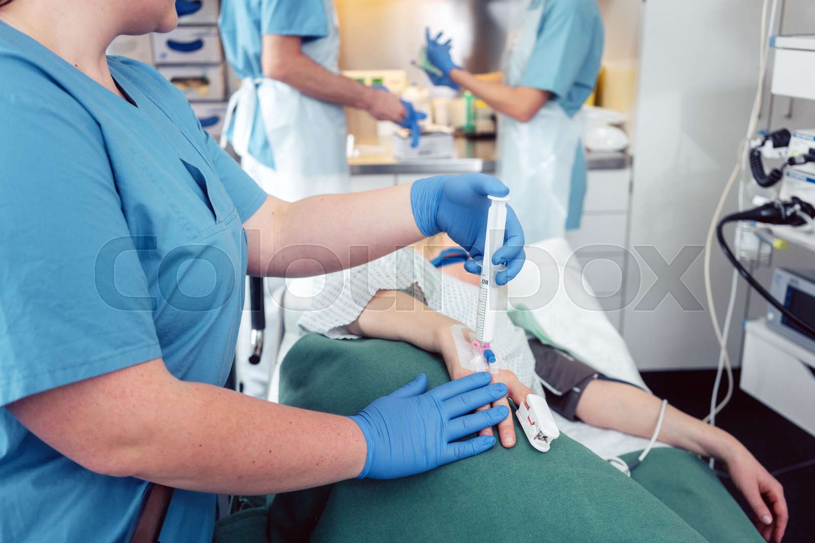 Nurse giving anesthesia to patient waiting for endoscopy | Stock image ...