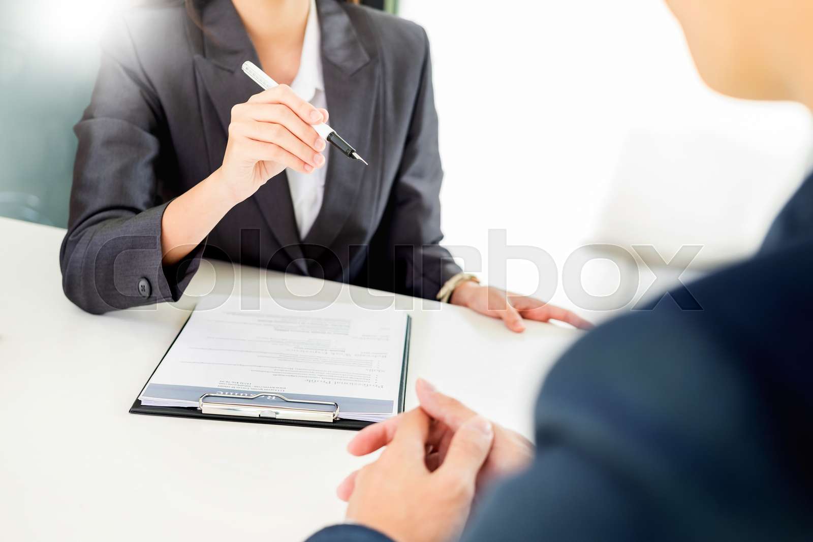 Female Manager conducting a job interview with female applicant looking ...