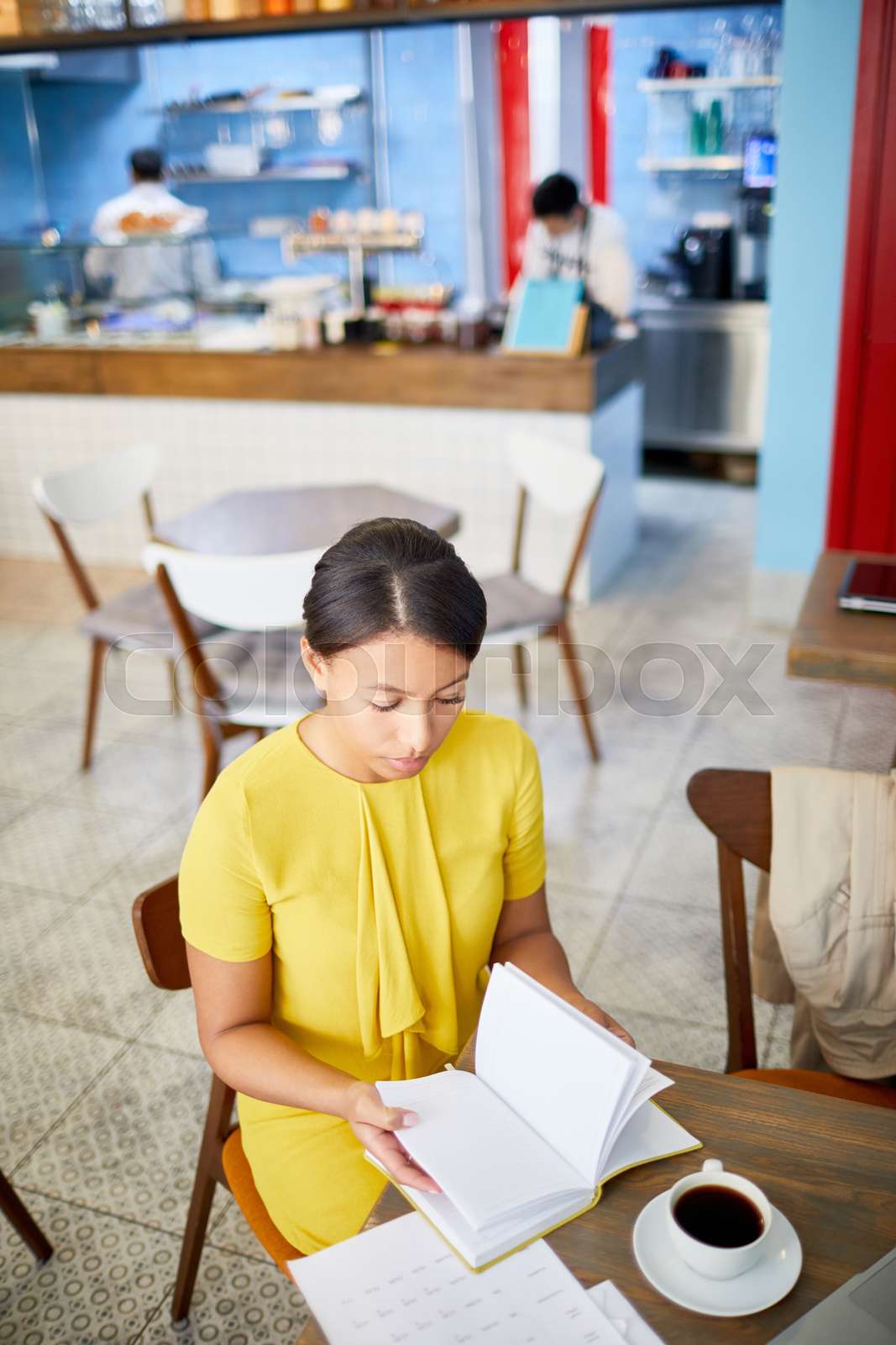 Reading in cafe | Stock image | Colourbox