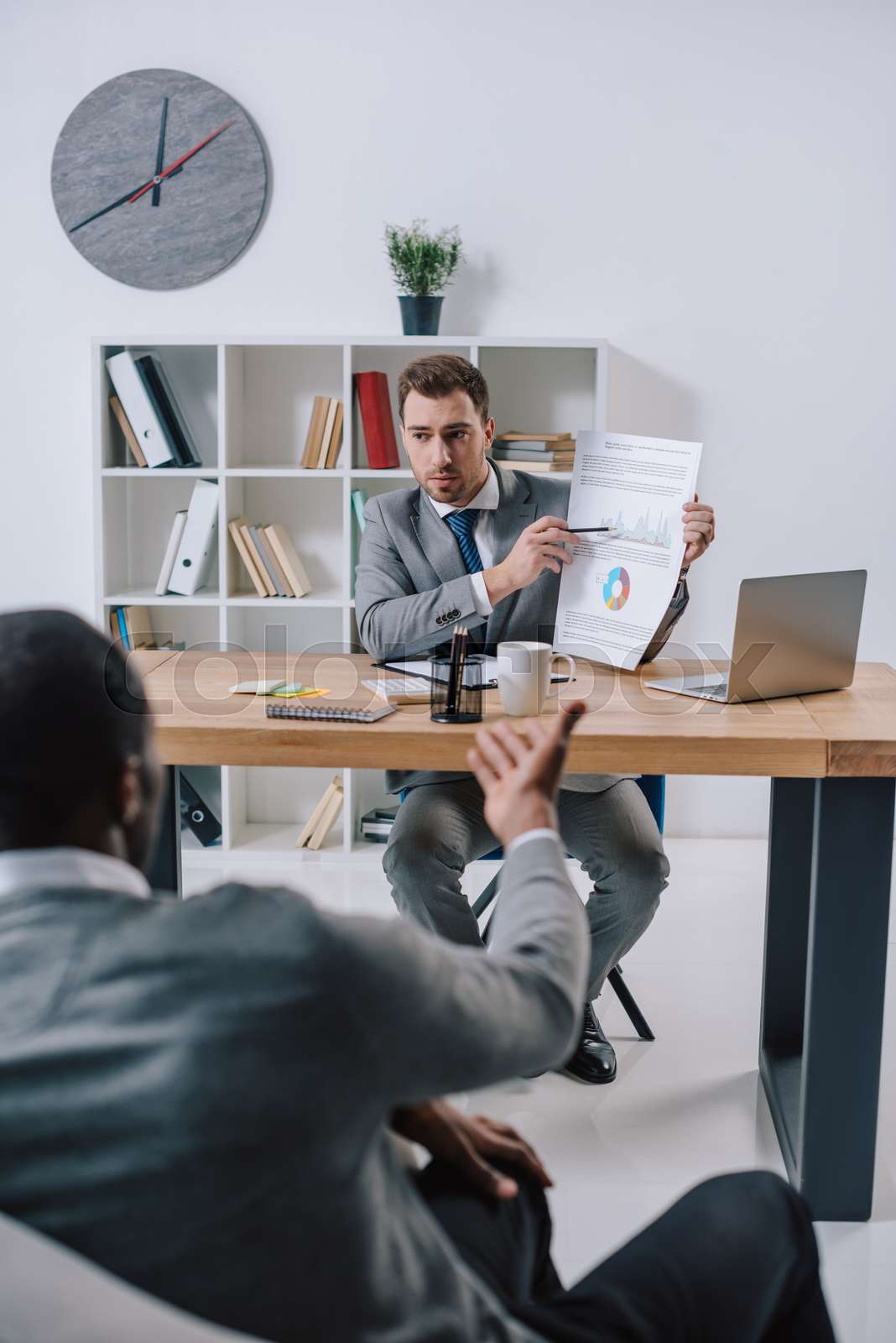 Financial Adviser Showing Presentation To Client Stock Image Colourbox