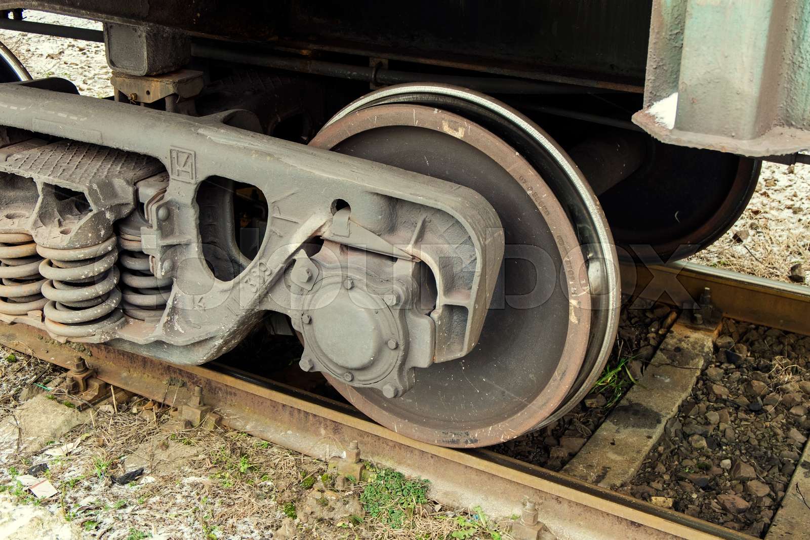 Wheel of a train with springs and a part of a suspension bracket ...