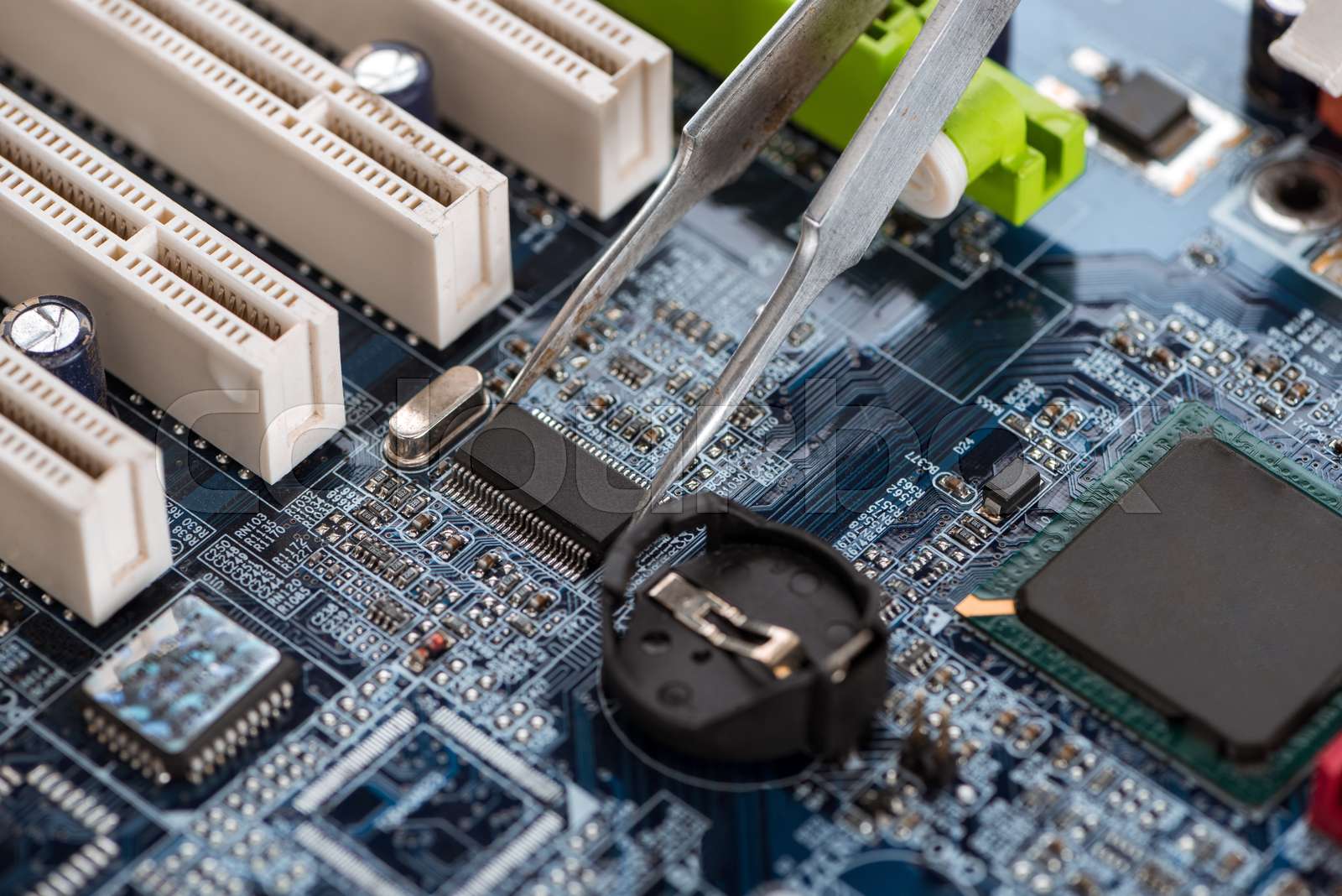 Fixing standard motherboard with microchips and schemes | Stock image ...