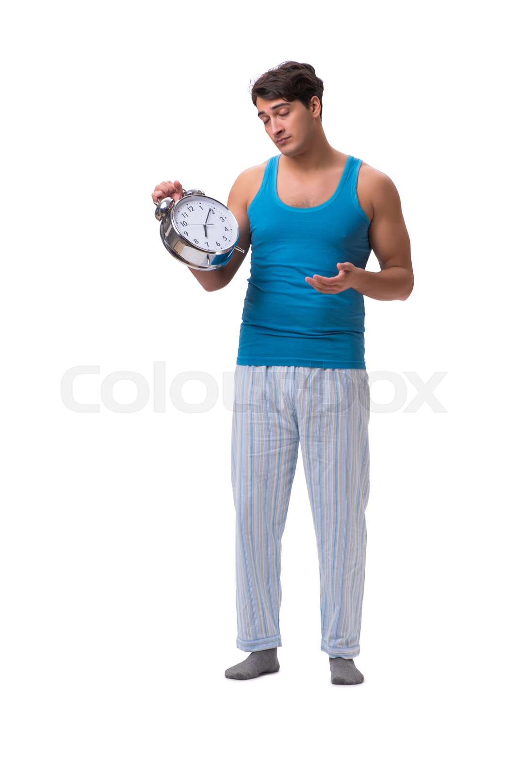 Man waking up with alarm clock isolated on white | Stock image | Colourbox