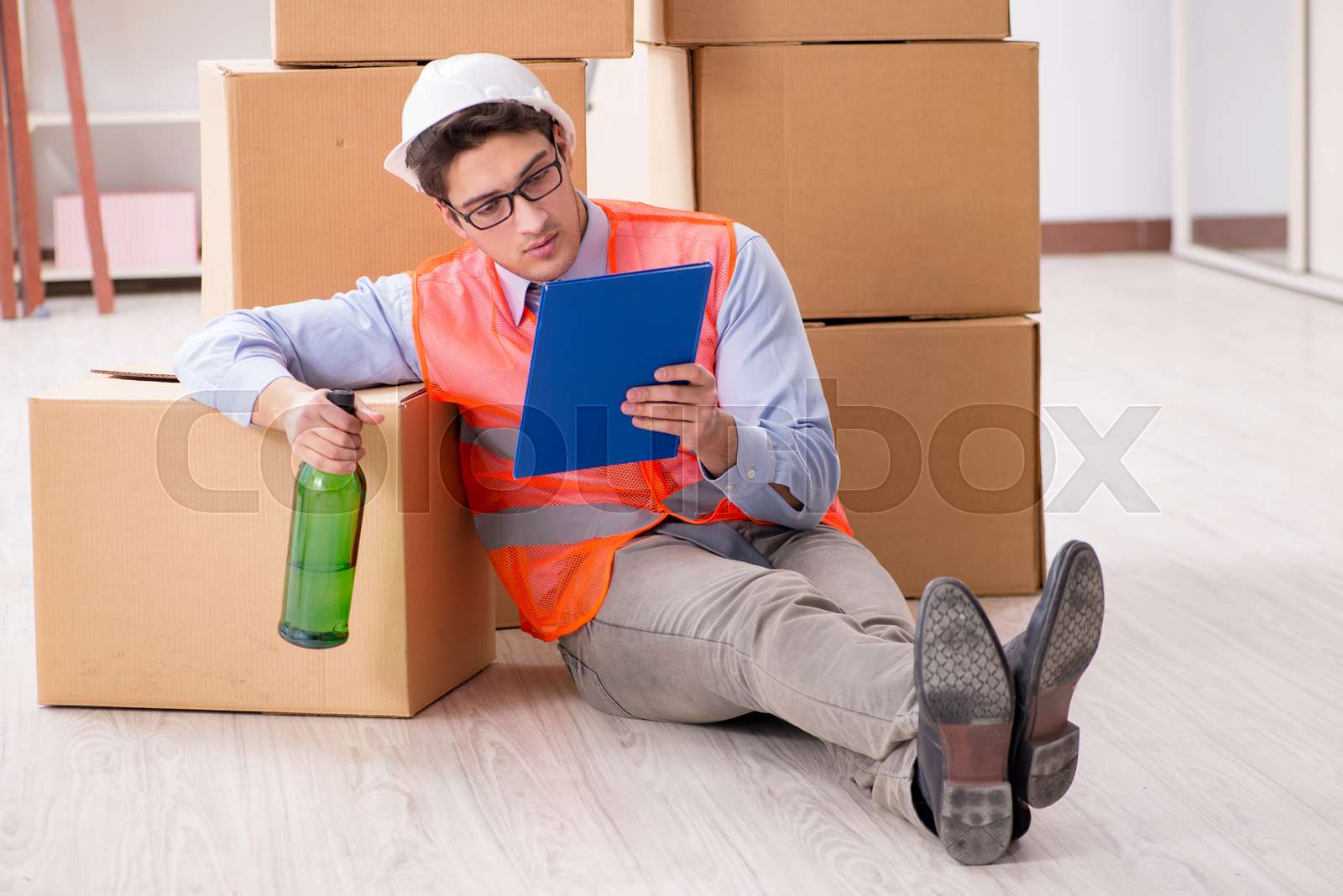 Delivery man drunk at work | Stock image | Colourbox