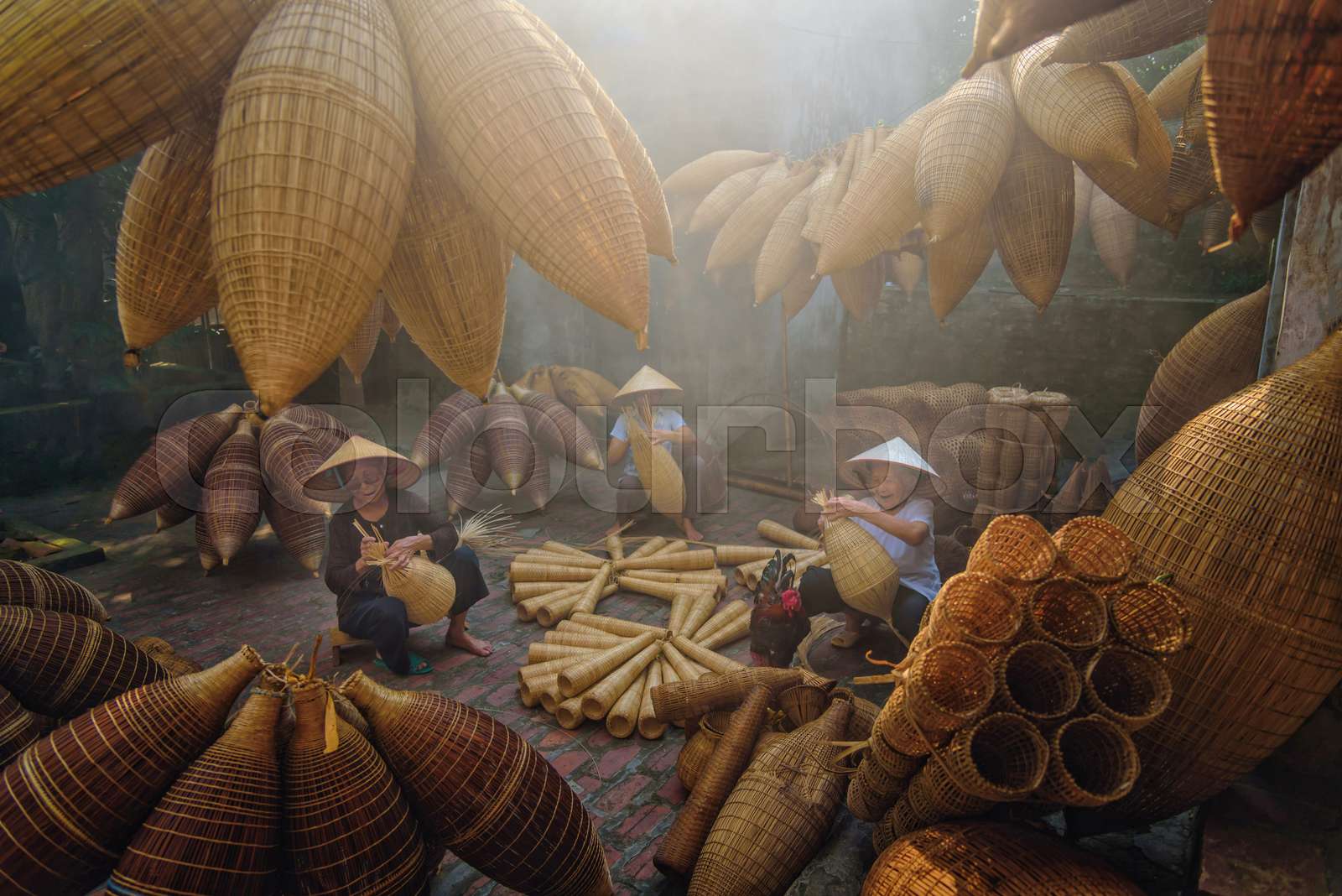 Vietnamese fishermen are doing basketry for fishing equipment at ...