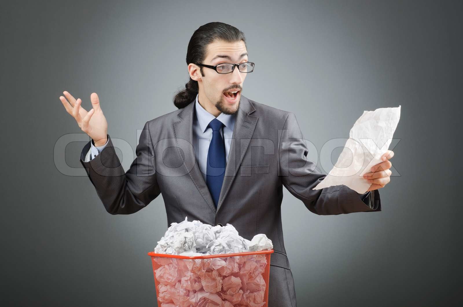 Man with lots of wasted paper | Stock image | Colourbox
