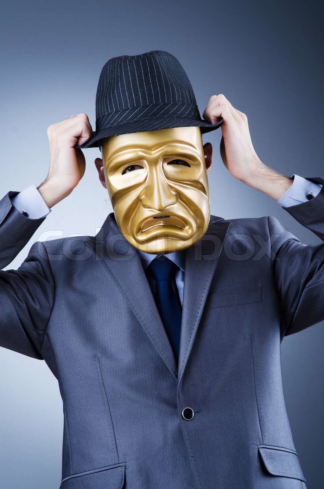 Businessman with mask concealing his identity | Stock image | Colourbox