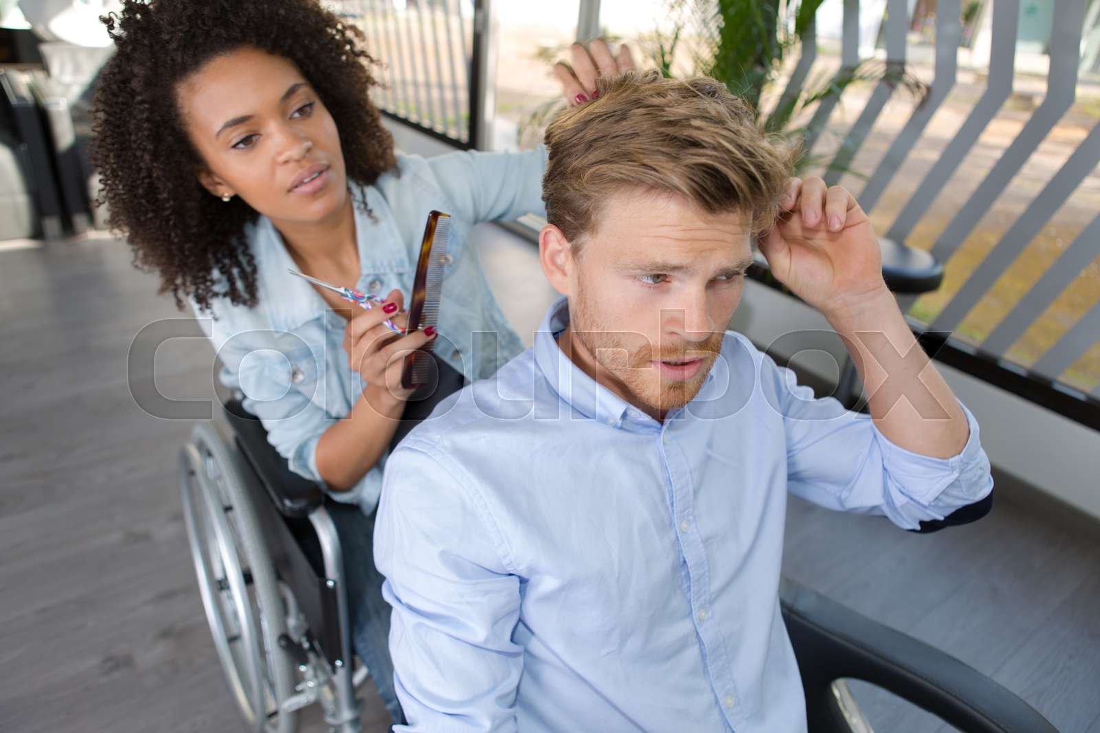 beautiful disabled hairdresser cutting handsome mans hair | Stock image ...