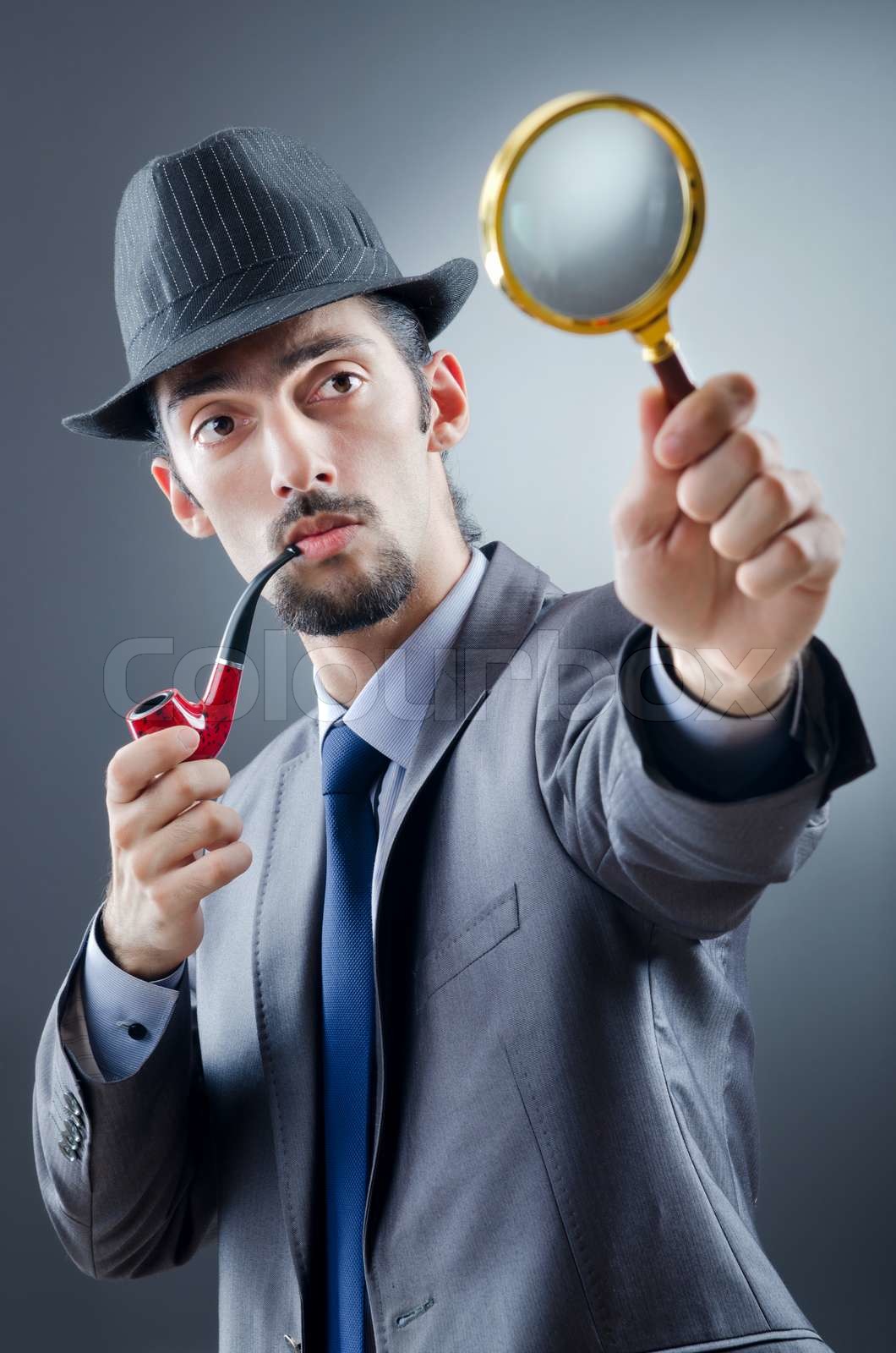 Detective with the smoking pipe | Stock image | Colourbox