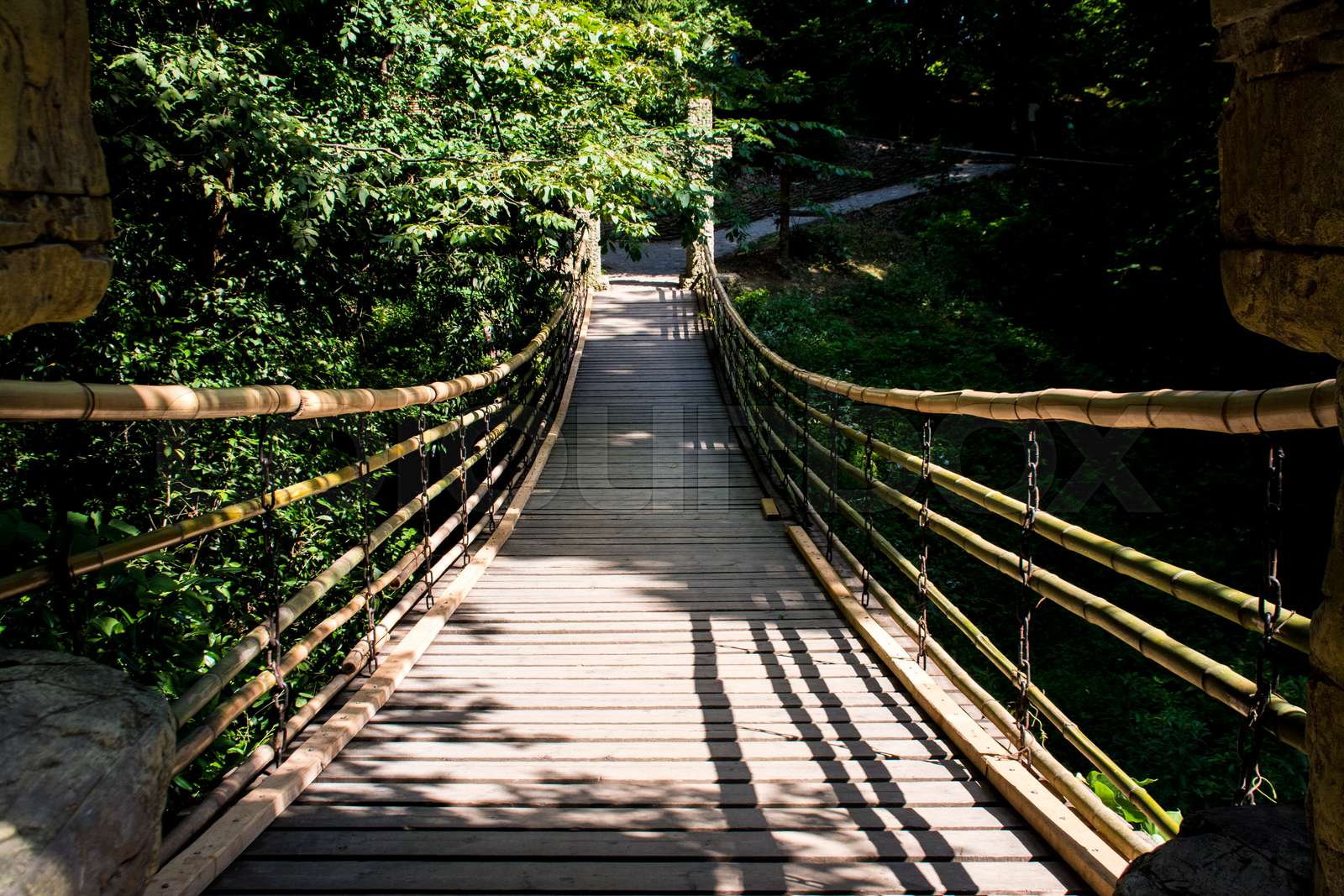 Bamboo pedestrian suspension bridge | Stock image | Colourbox