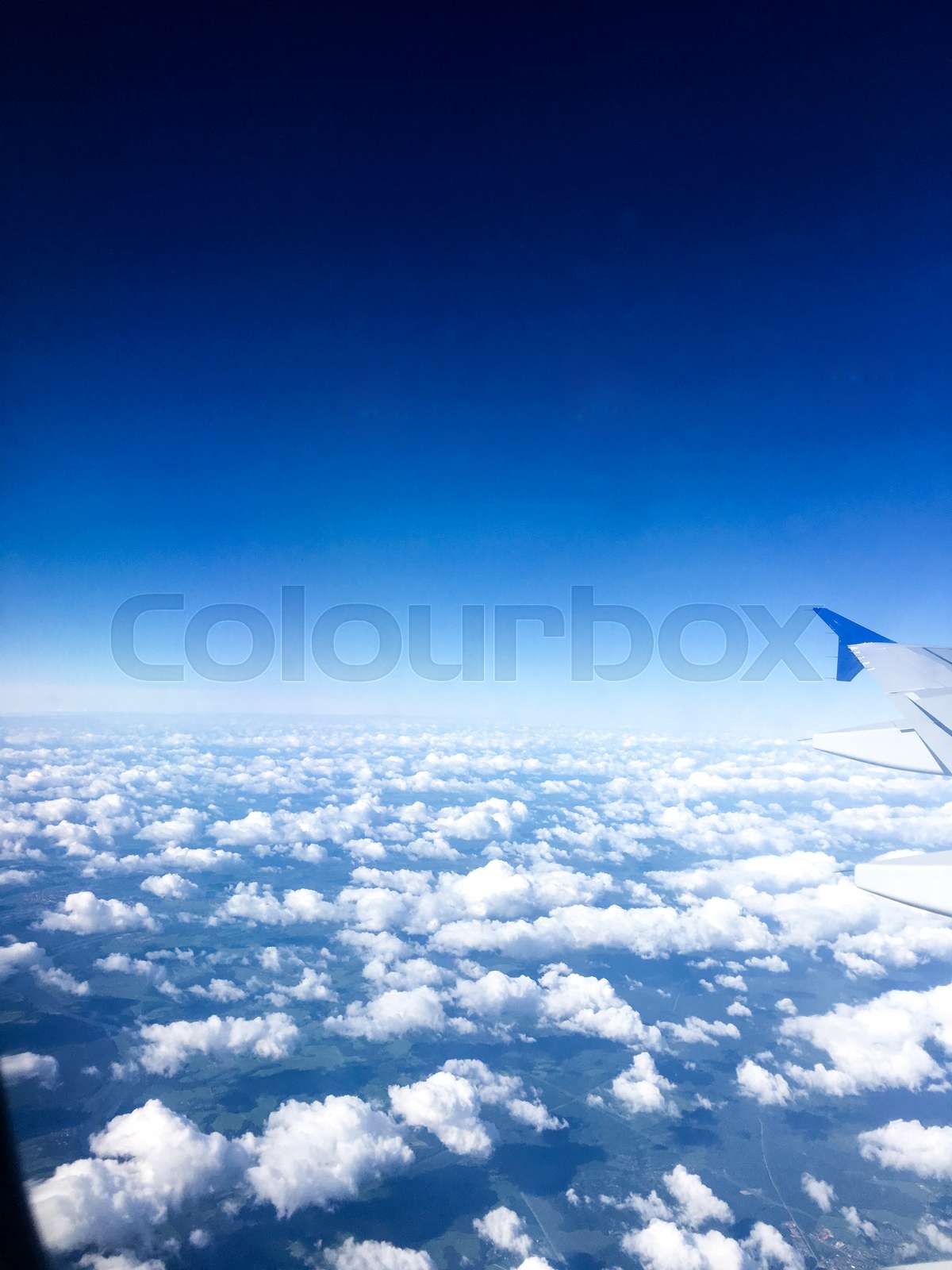 Airplane wing in the sky view | Stock image | Colourbox