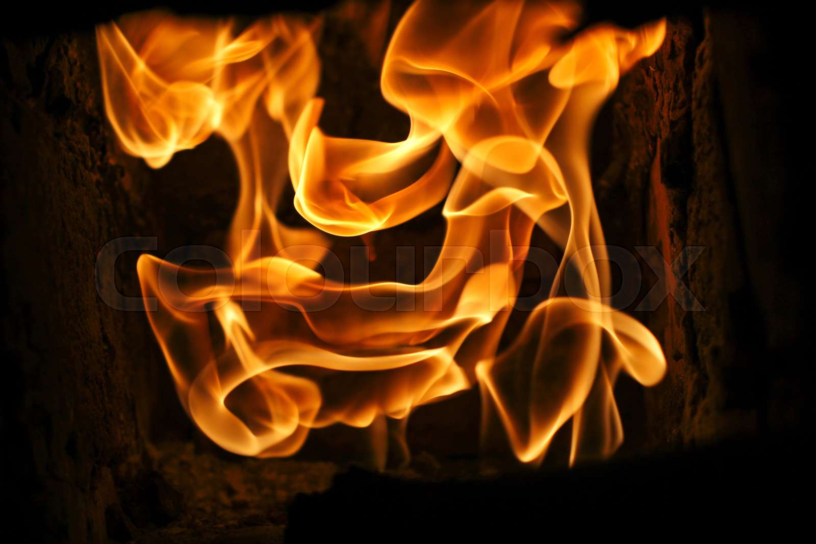 beautiful amazing view at burning fire flames at stone stove in room ...