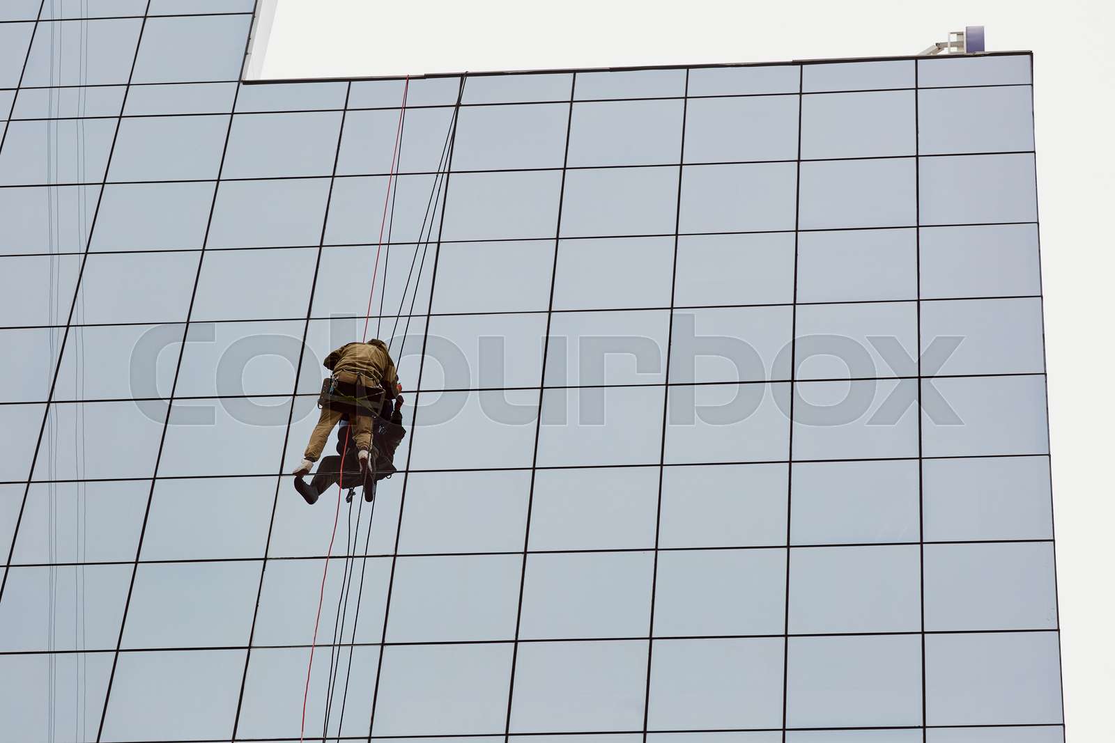 High-altitude work on tall buildings skyscrapers | Stock image | Colourbox