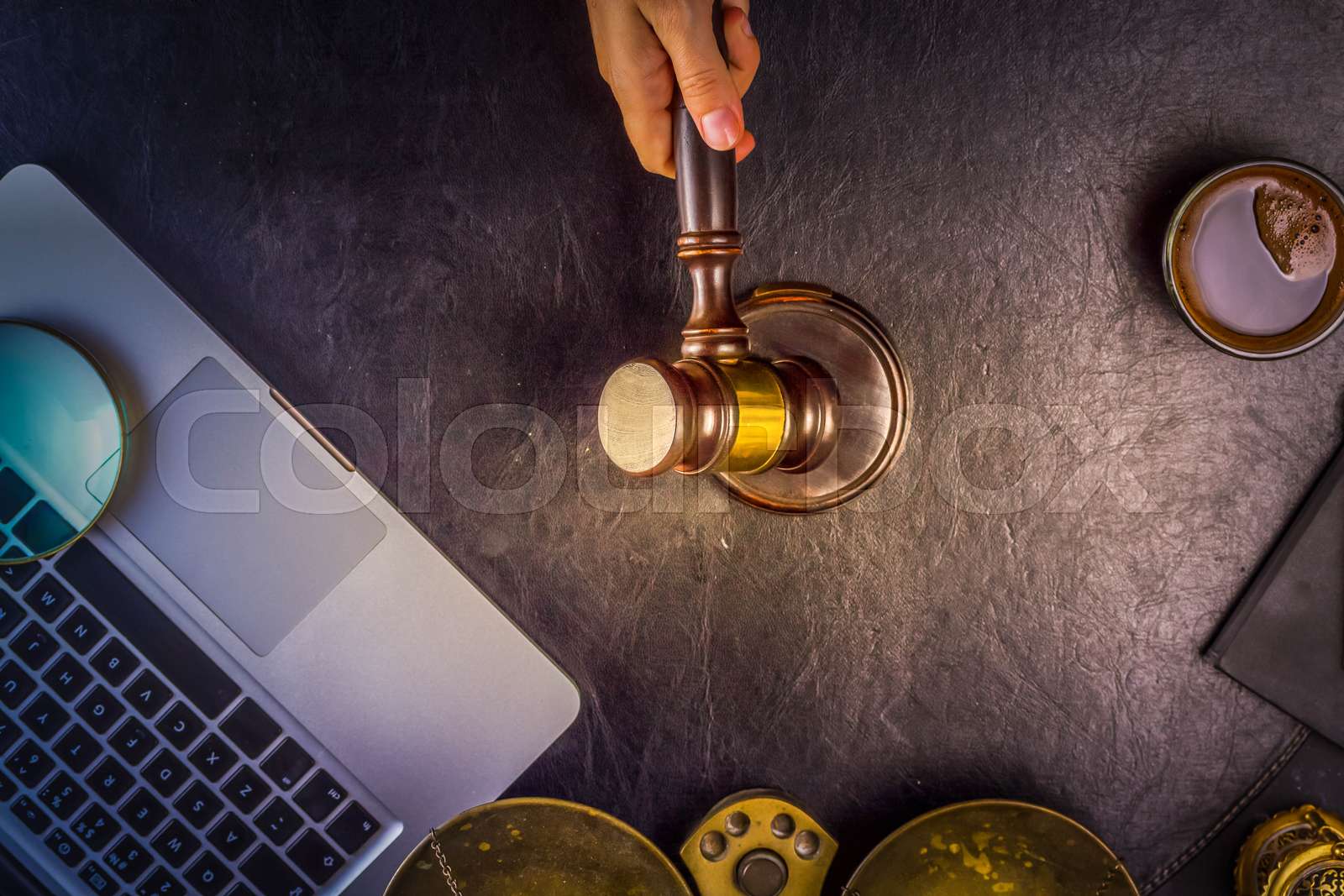 Hand holding law gavel | Stock image | Colourbox
