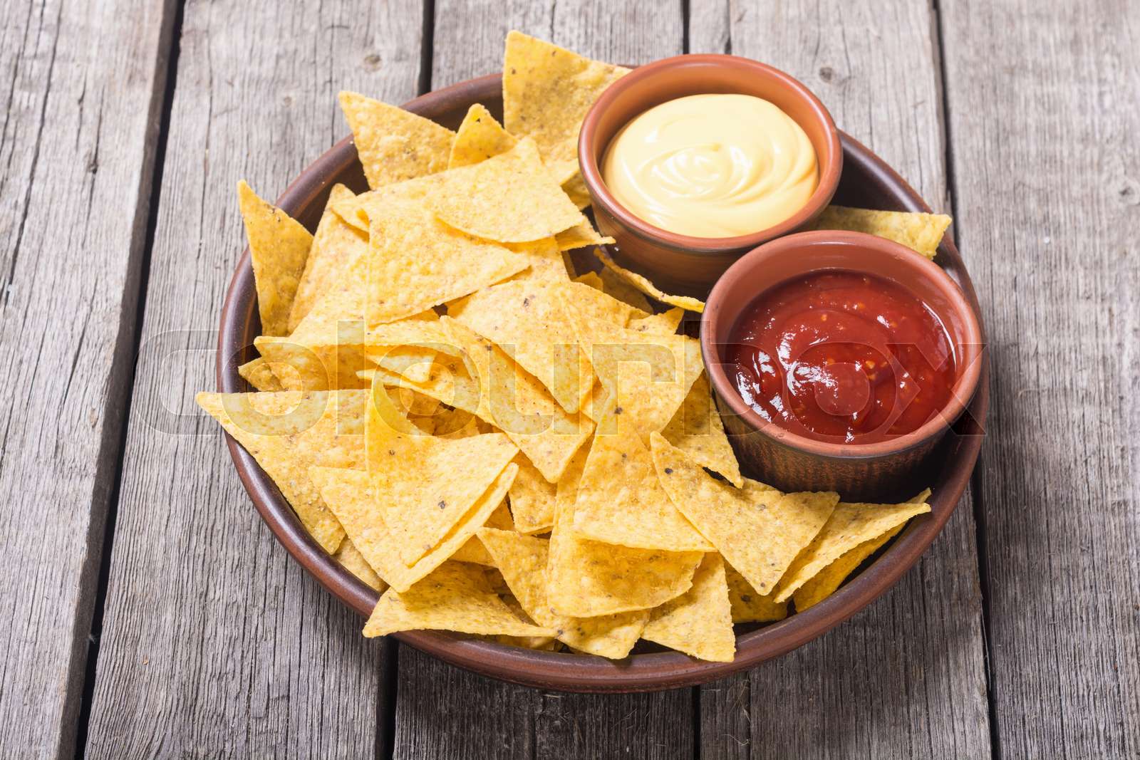 Crispy chips nachos with tomato and cheese sauce | Stock image | Colourbox