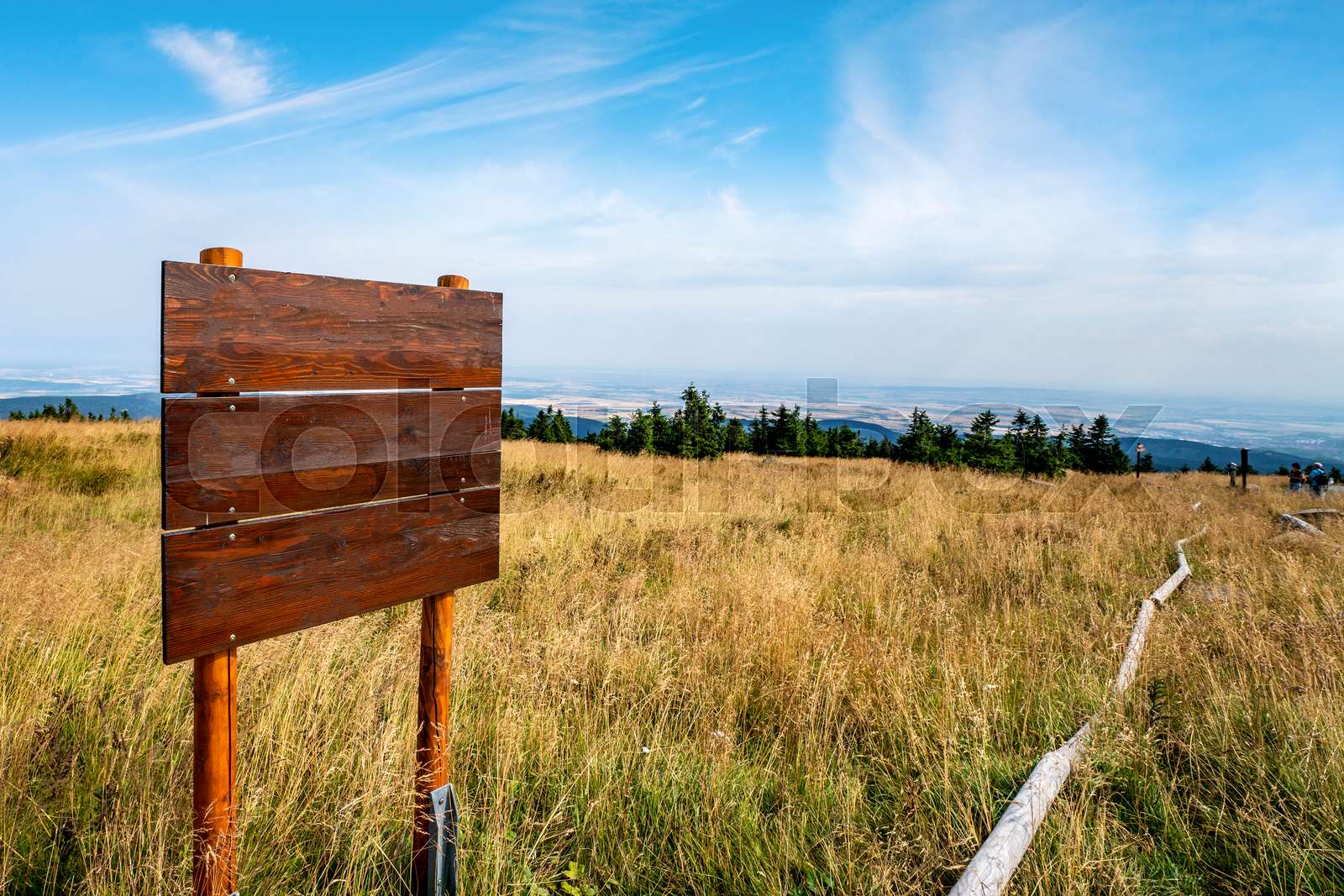 Wooden multi sign on the top of a hill | Stock image | Colourbox