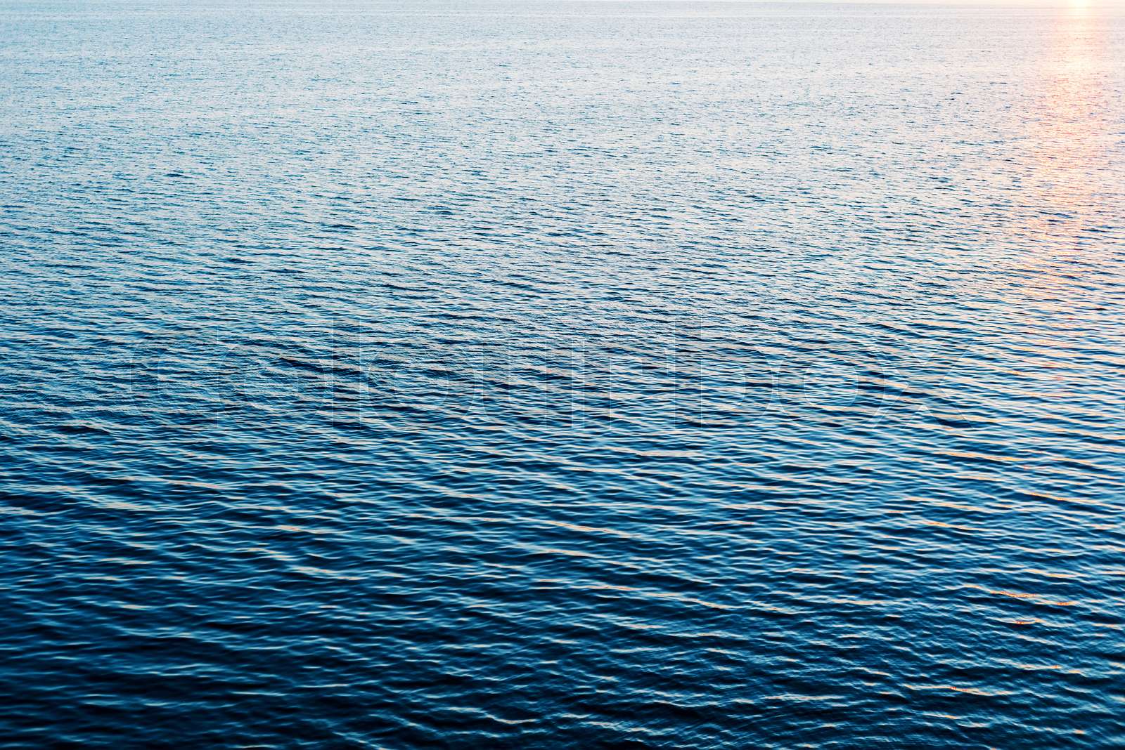 aerial view to water in sunset with sun reflections | Stock image ...