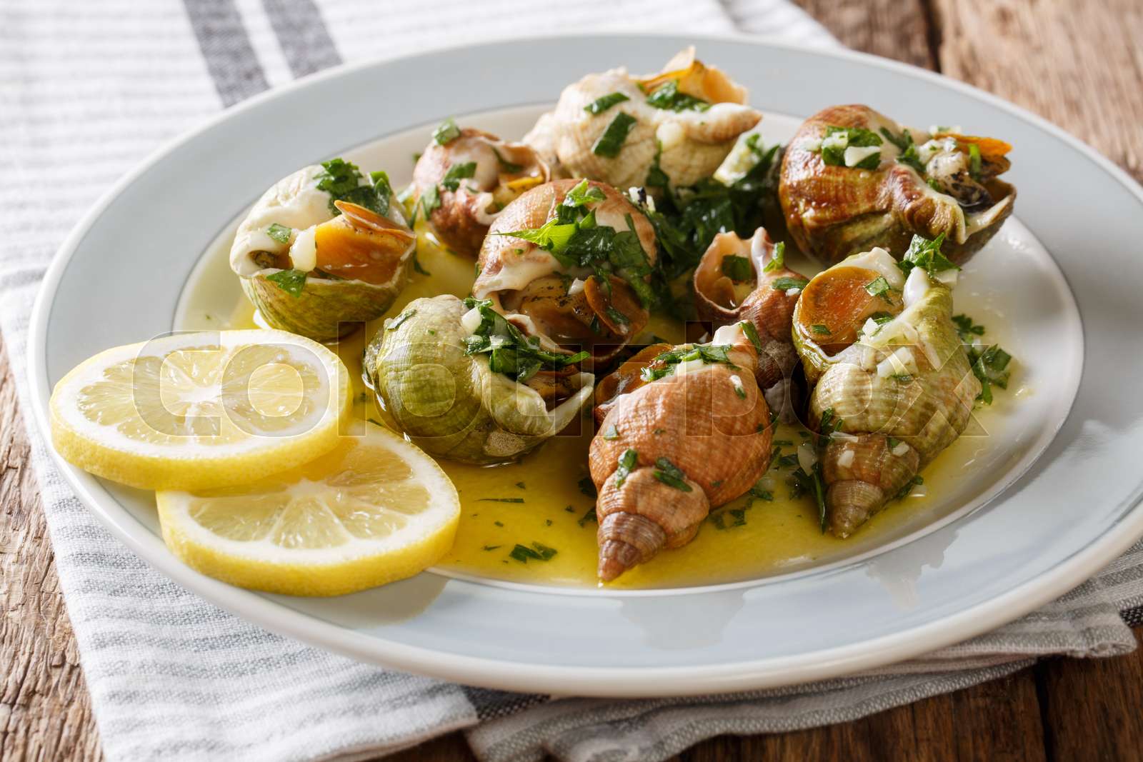 Bulots Cuits - Cooked Waved Whelks with a sauce of butter, garlic and ...