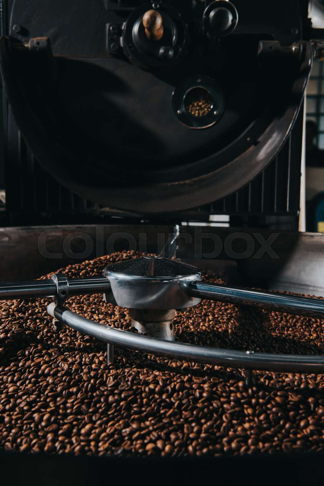 Roasting and mixing process in traditional coffee roaster cylinder ...